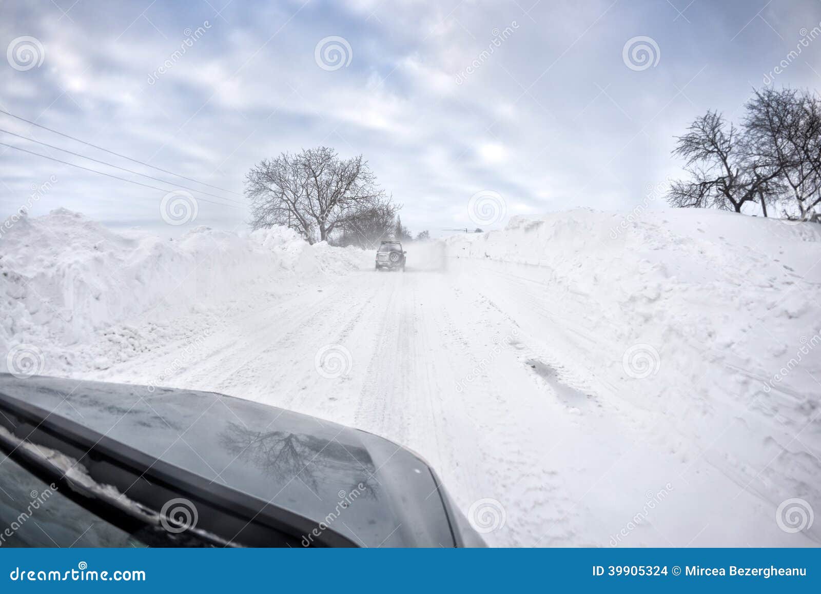 Driving car on snowy road stock photo. Image of cloud - 39905324