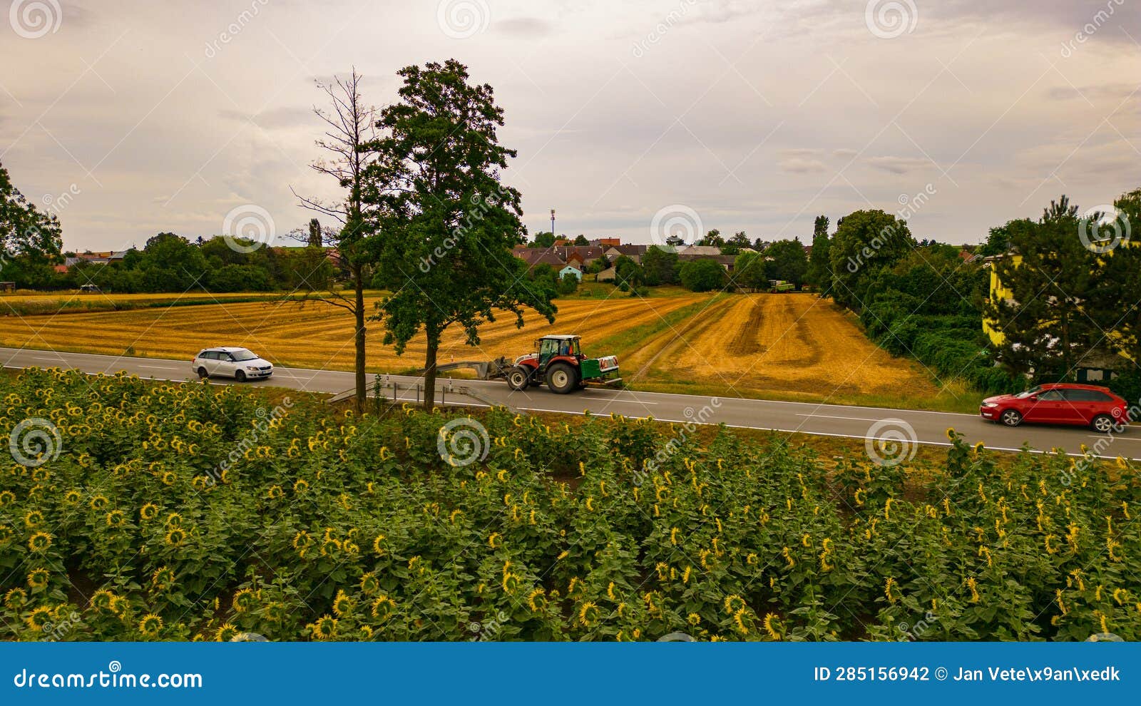 Driving Cars on the Road between the Fields Stock Photo - Image of ...