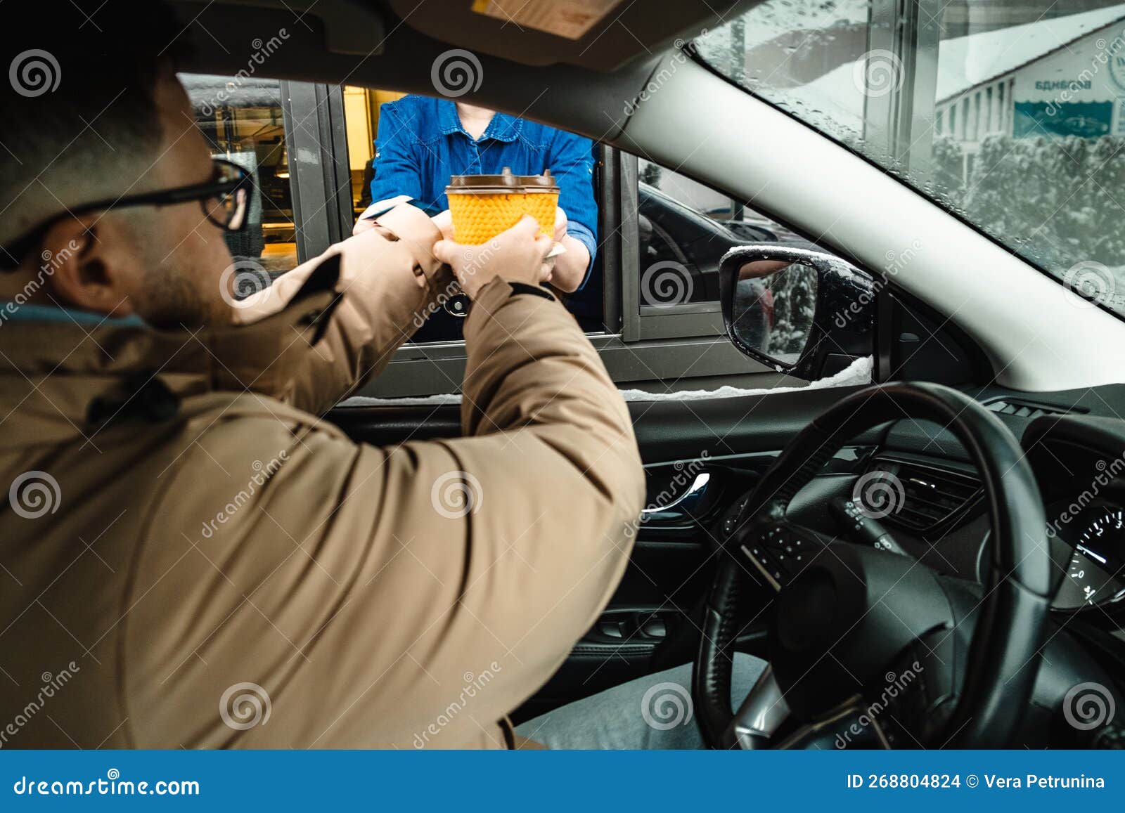 By Driving through or Drive through, he Picks Up a Cup of Coffee from ...