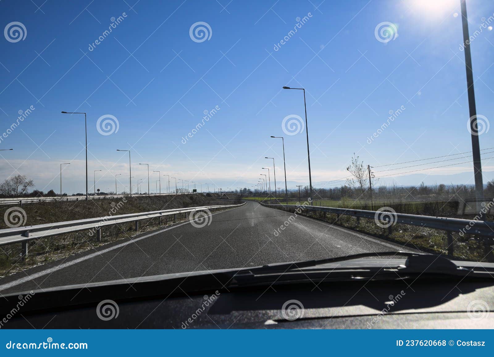Driving on empty road stock photo. Image of straight - 237620668