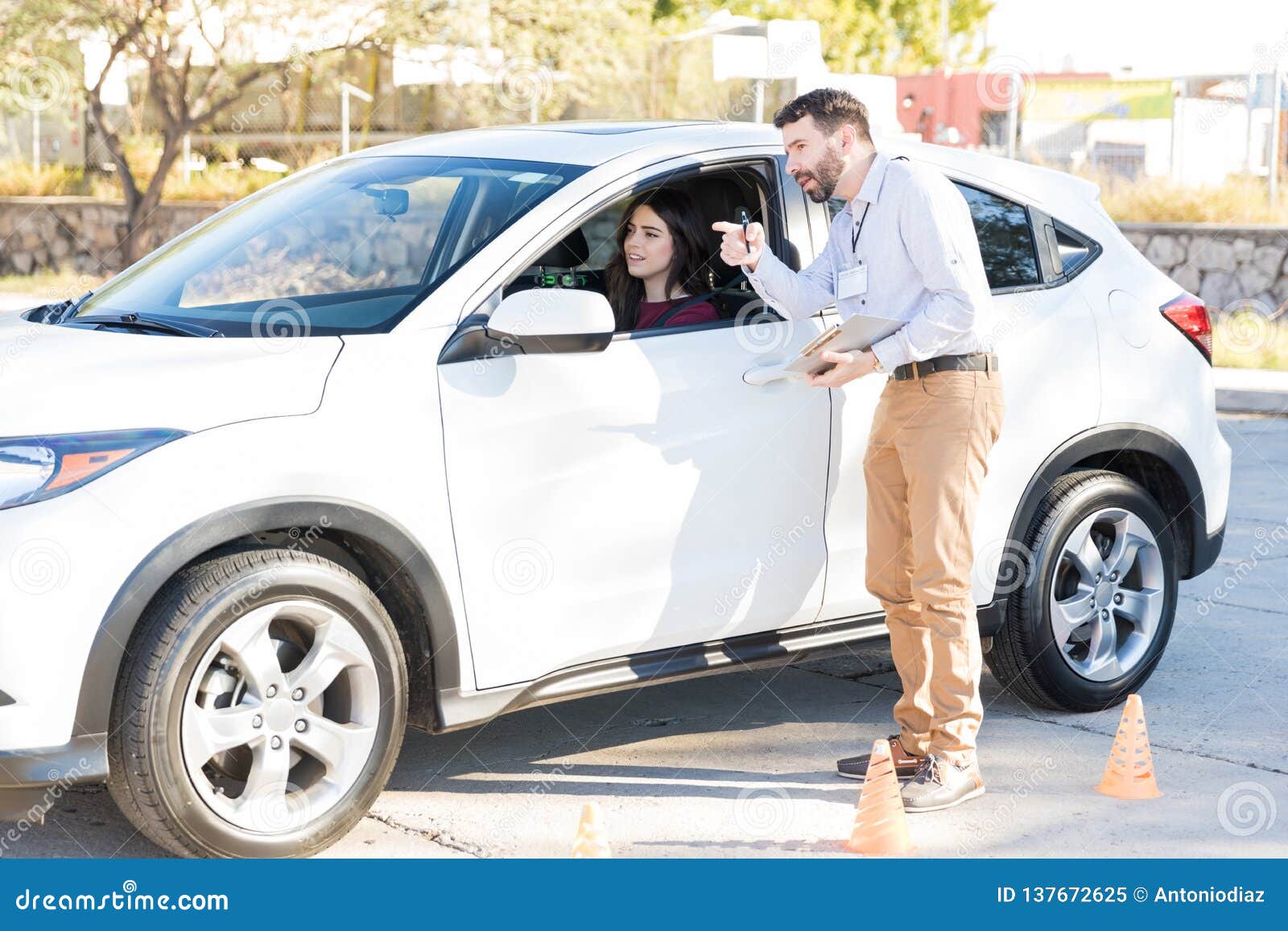Auto Trainer and Student Communicating during Driving Lessons Stock ...