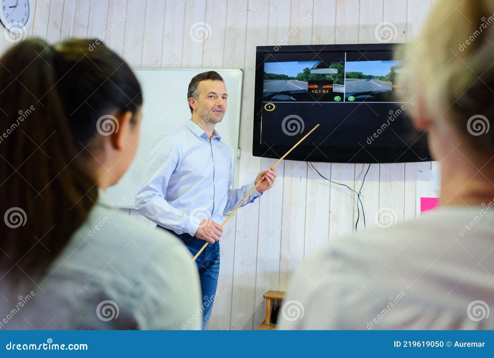 Driving Instructor Pointing at Board in Classroom Stock Photo - Image ...