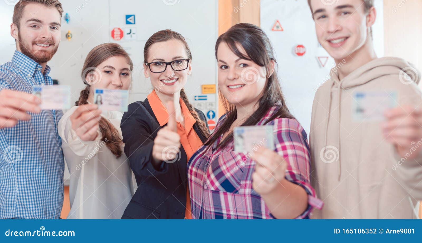 Driving Instructor and Students Showing Their New Licenses Stock Photo ...