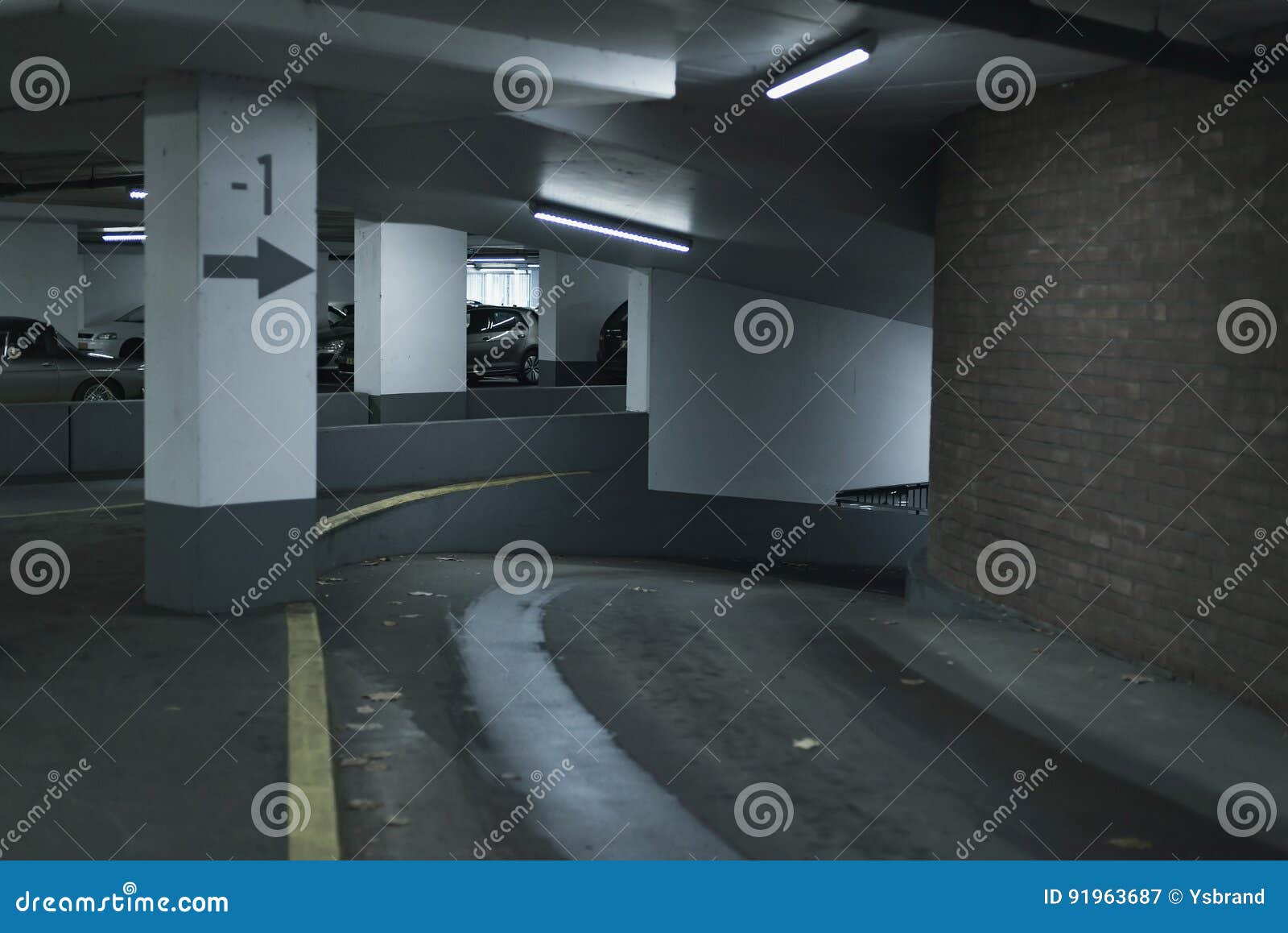 Driving Lane Going Down in Parking Garage. Stock Image - Image of ...