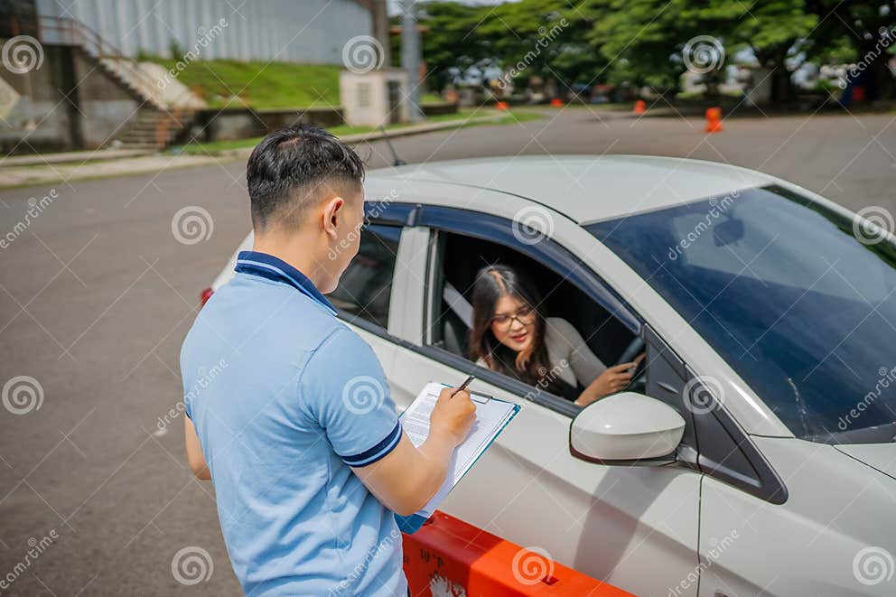 Driving Lesson in Progress the Instructor is Evaluating the Student ...
