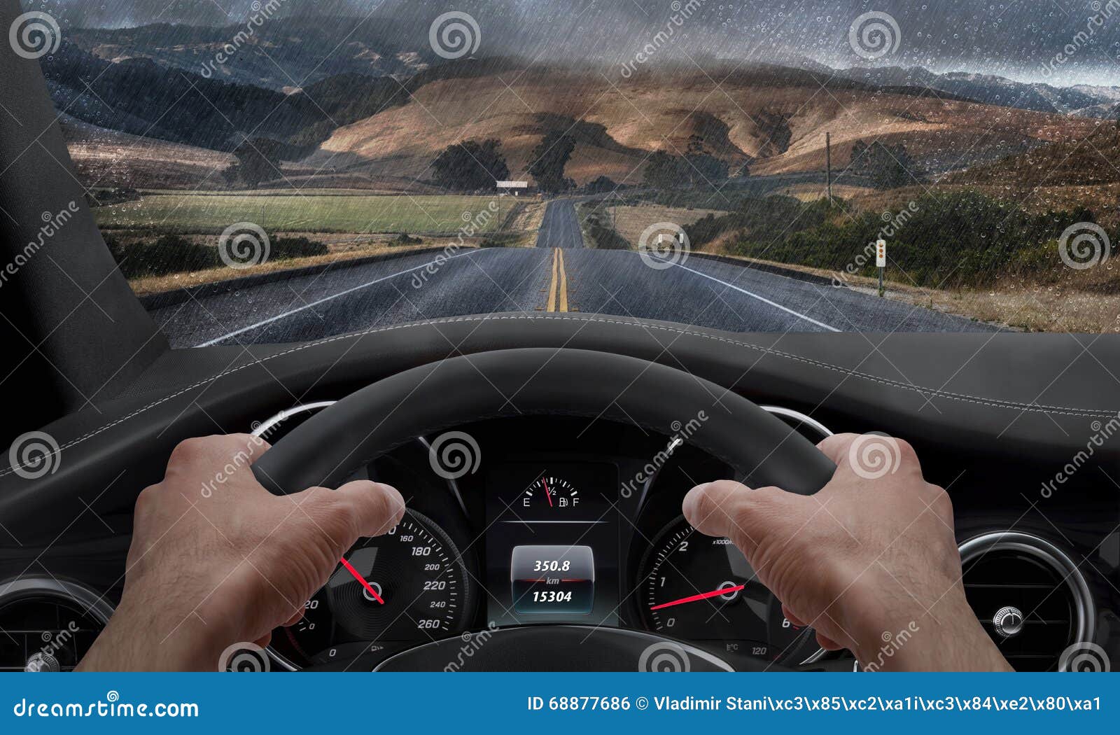 Driving in Rainy Weather. View from the Driver Angle while Hands on the ...