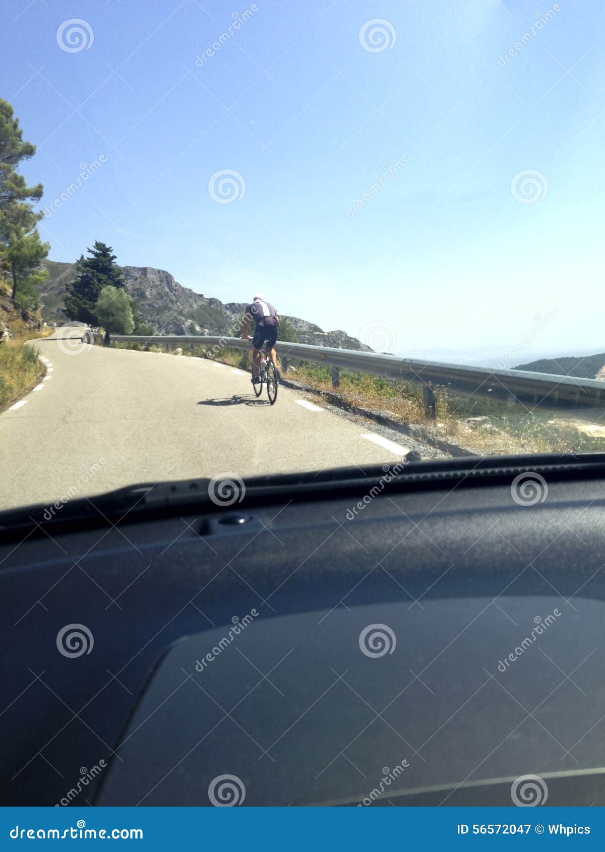 Driving Slow Behind a Cyclist Stock Image - Image of rider, people ...