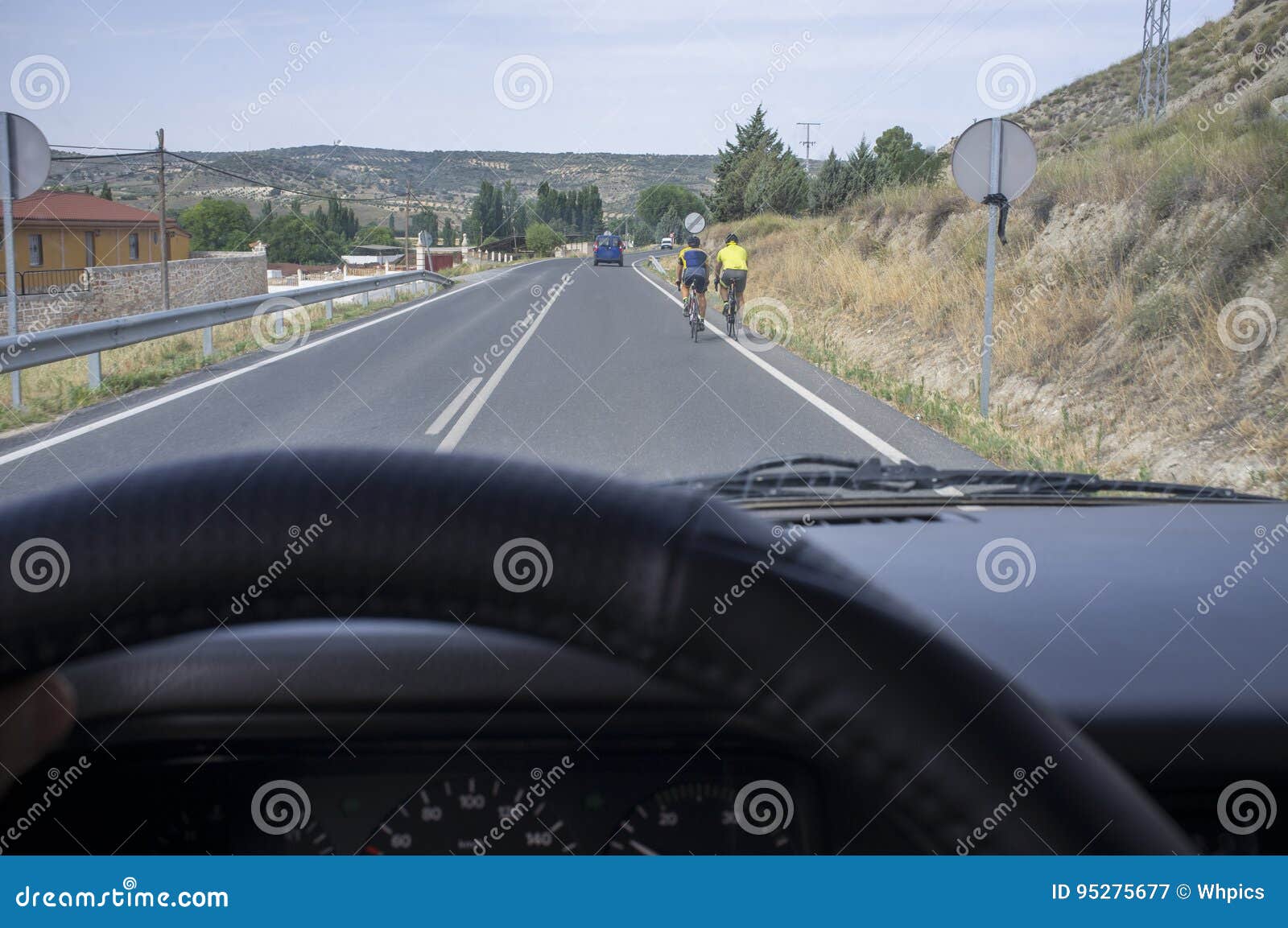 Driving Slowly Behind Cyclists at Local Road Stock Image - Image of ...