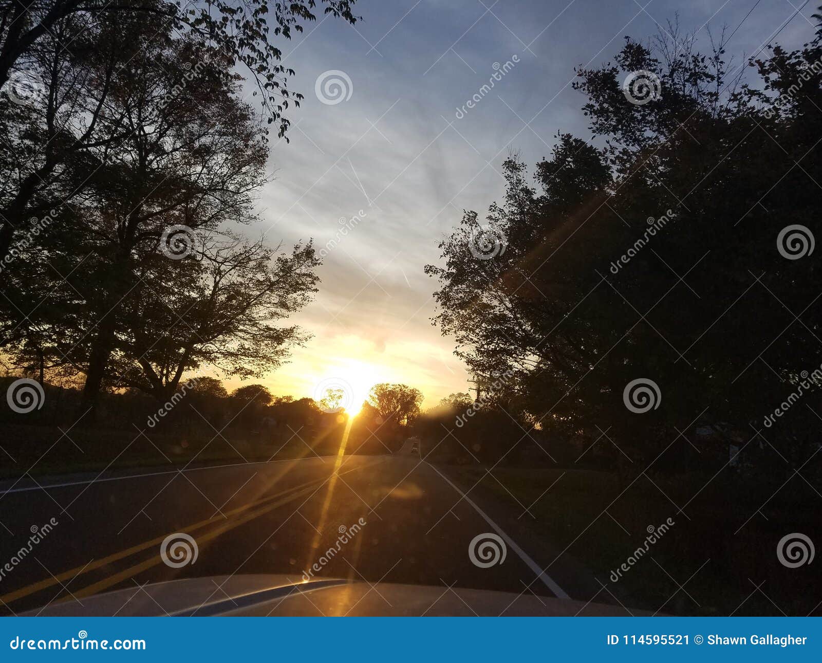 Driving into a Sunset stock image. Image of driving - 114595521