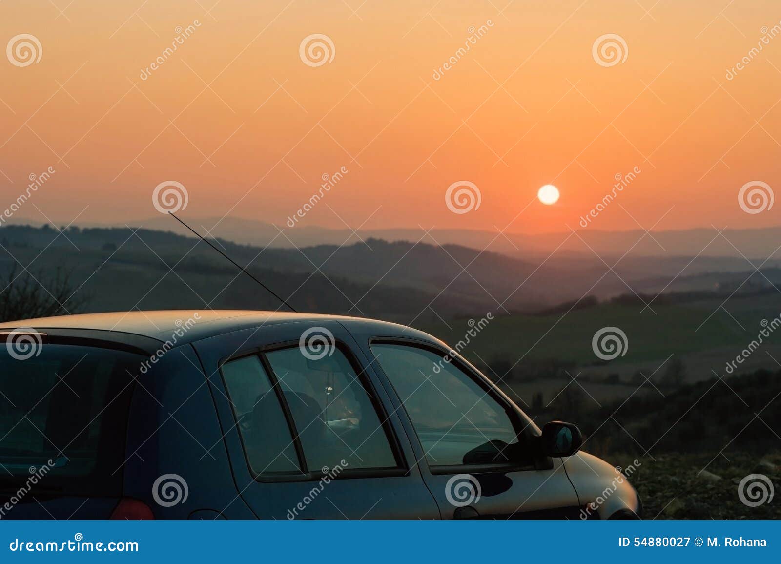 Driving into the sunset stock image. Image of sunset - 54880027