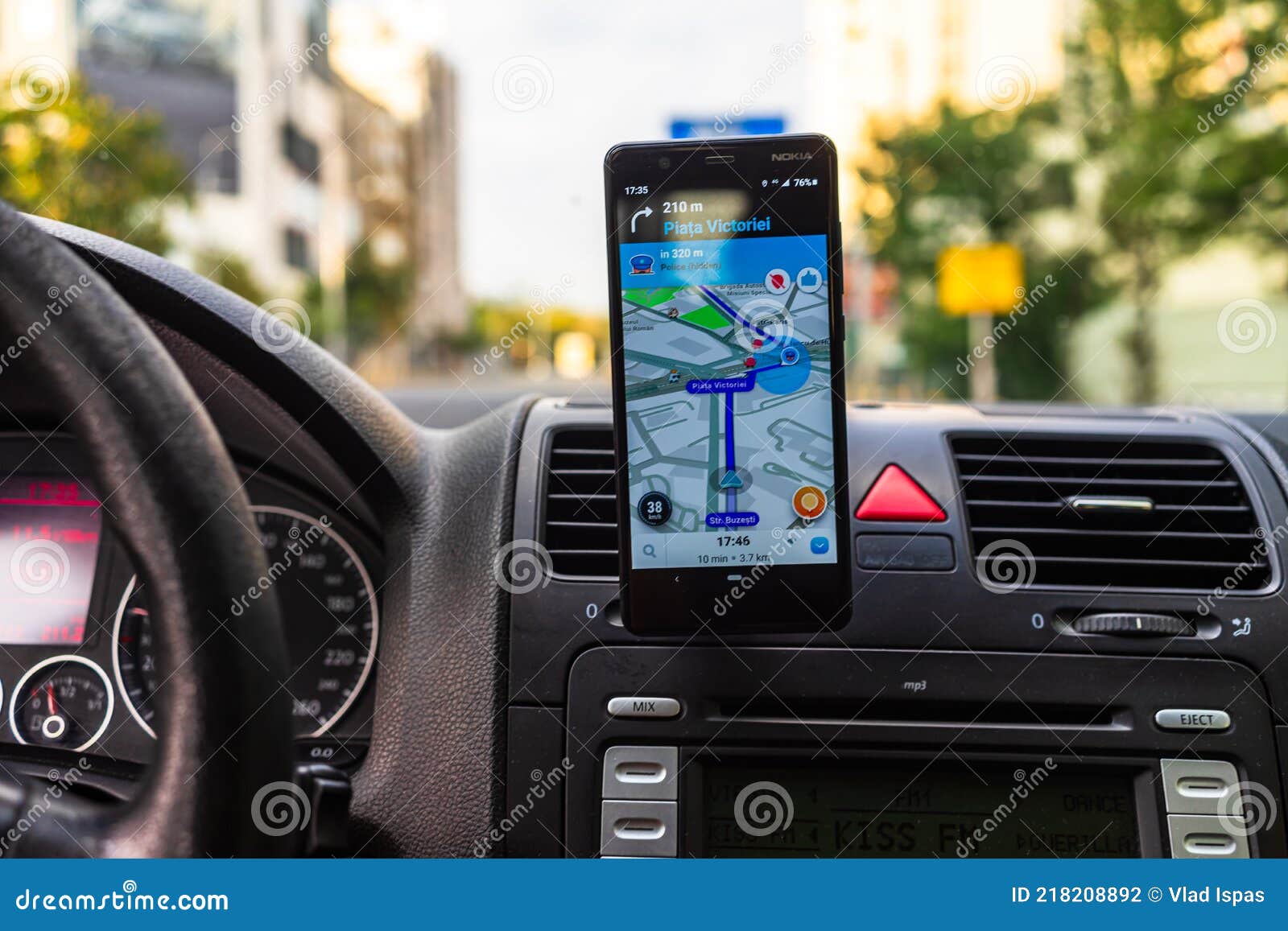 Driving And Using Waze Maps Application On Smartphone On Car Dashboard Driver Using Maps App