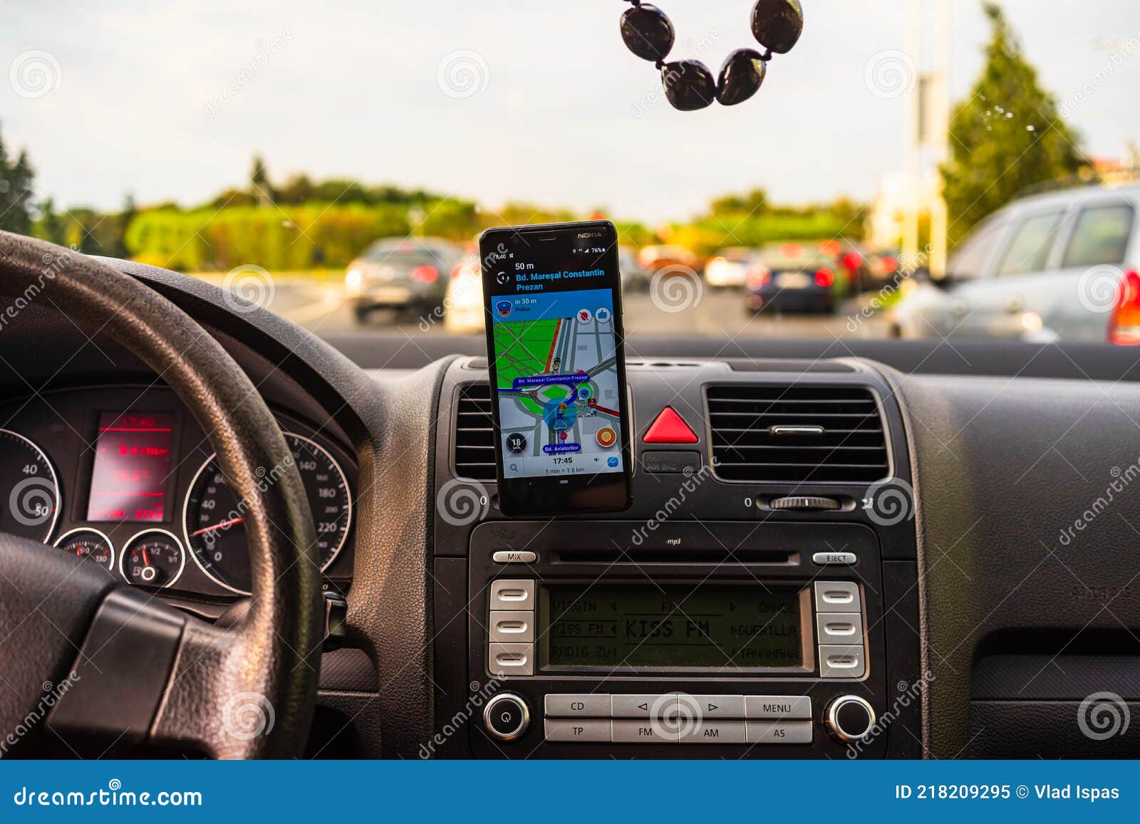 Driving and Using Waze Maps Application on Smartphone on Car Dashboard ...