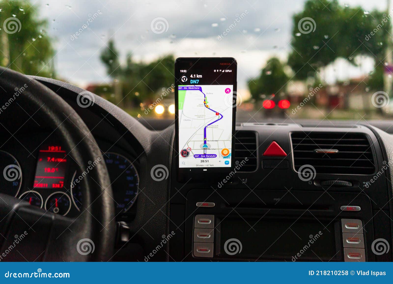 Using Waze Maps Application On Smartphone In Car Dashboard. Driver ...