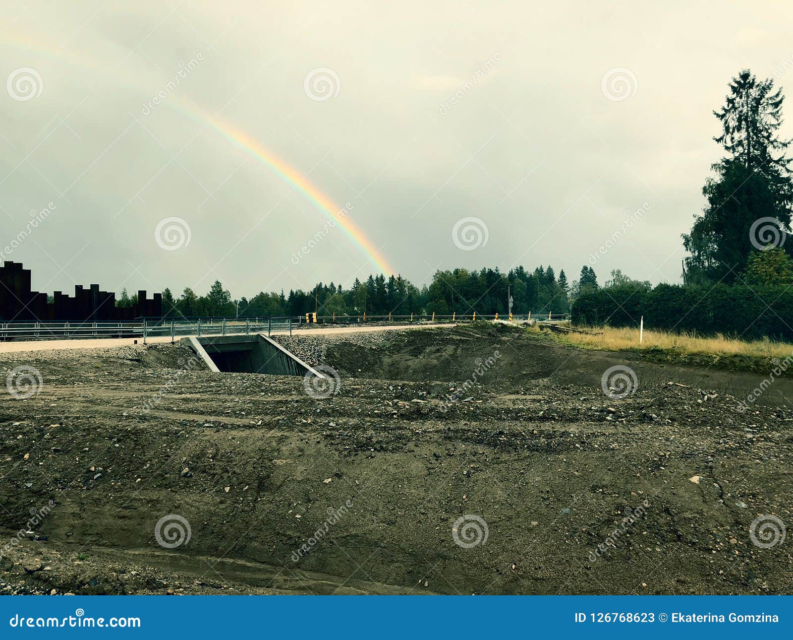 Drizzle on the Windshield while Driving in Rain. Wet Road and Rainbow ...