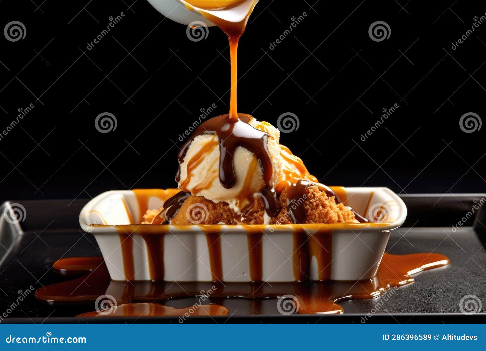 Drizzling Caramel or Chocolate Sauce on Ice Cream Stock Image - Image ...