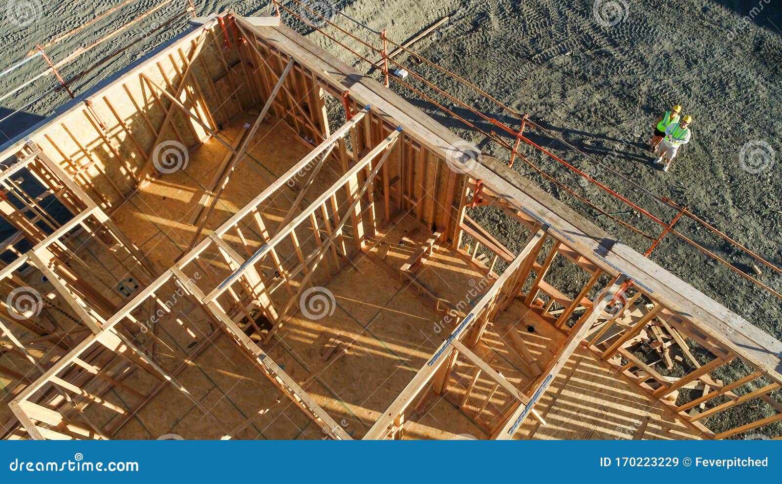 Drone Aerial View of Home Construction Site with Pilot Below Stock ...