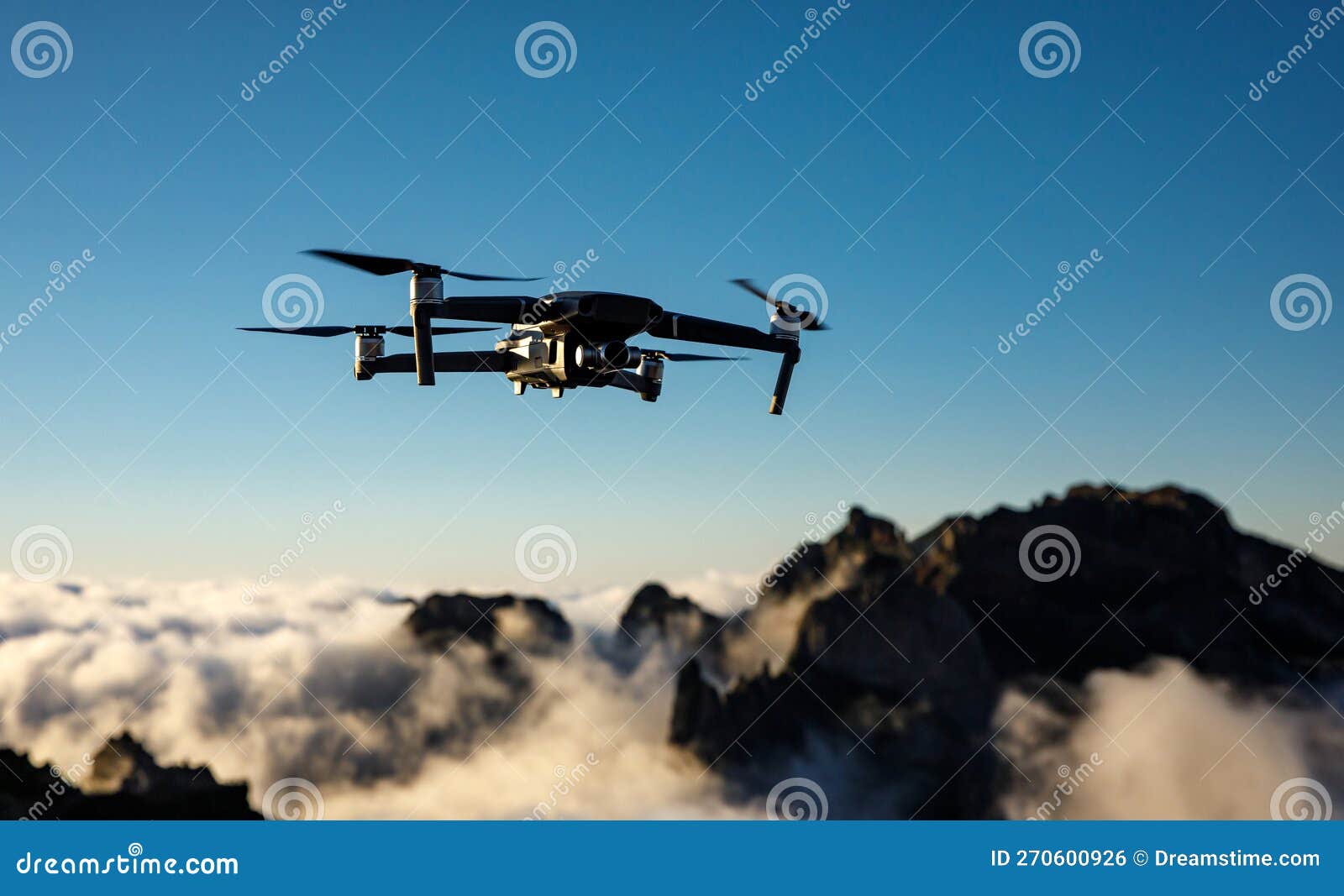 Drone with Camera Flying Over the Mountains Stock Photo - Image of ...