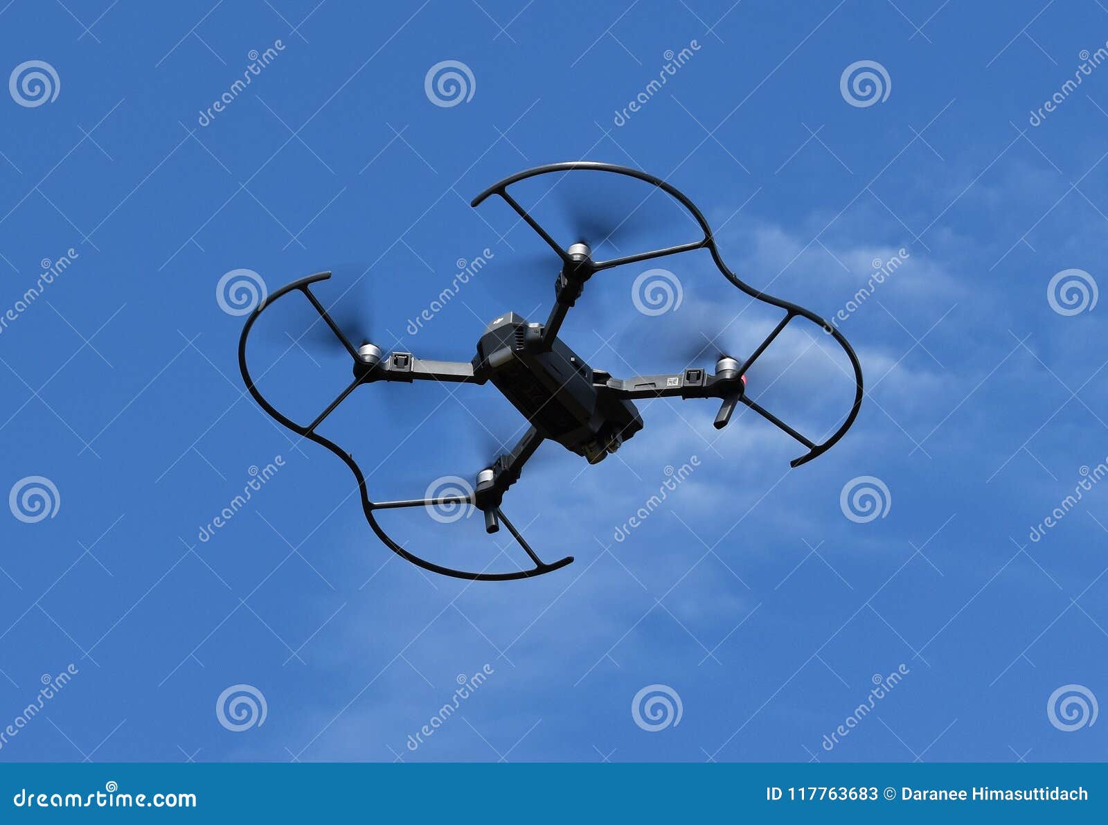 Drone Copter Flying In The Air With Blurred Man On Background Stock ...