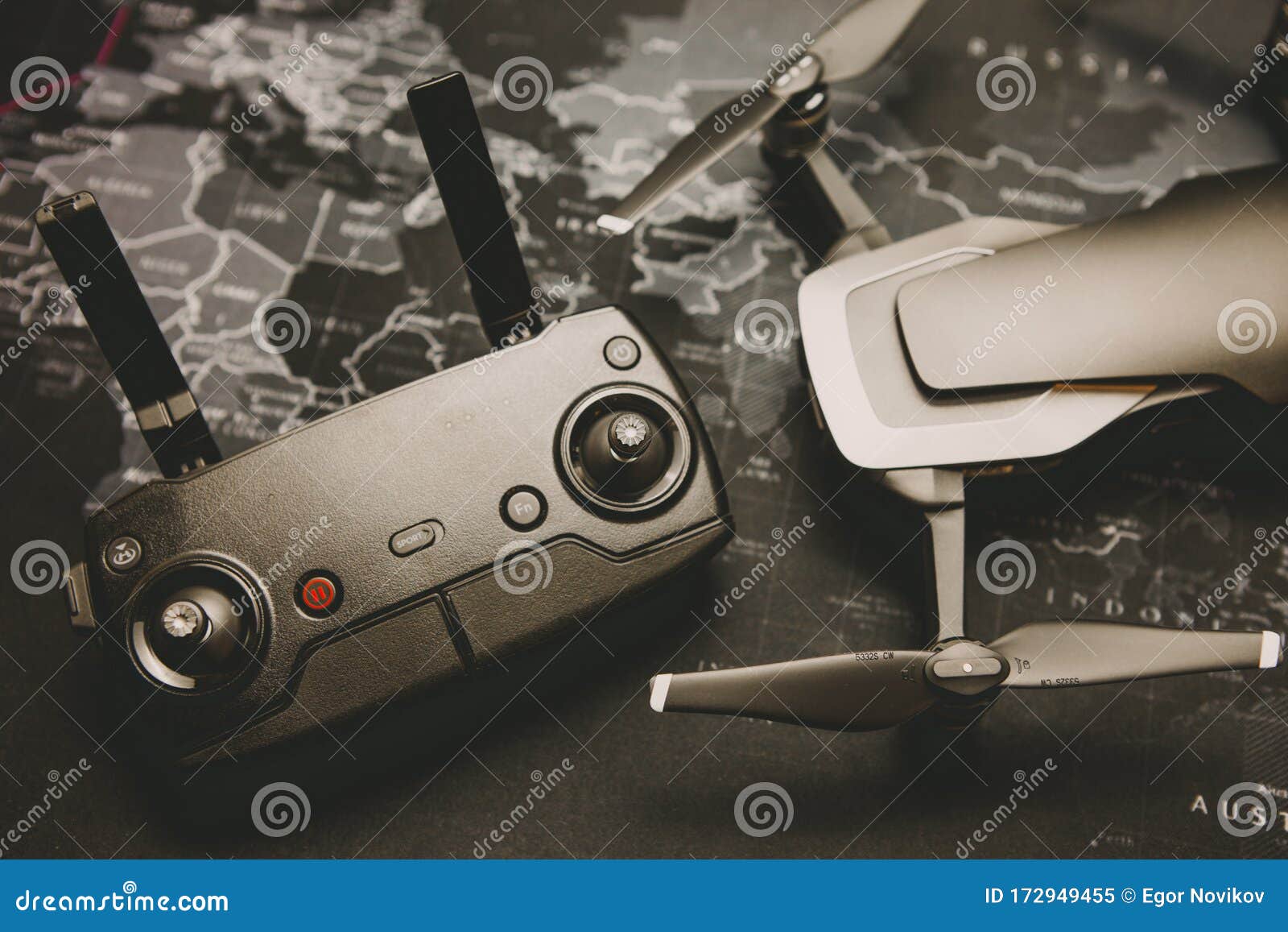 Drone Copter with Remote Controller on World Map Background, Close-up ...