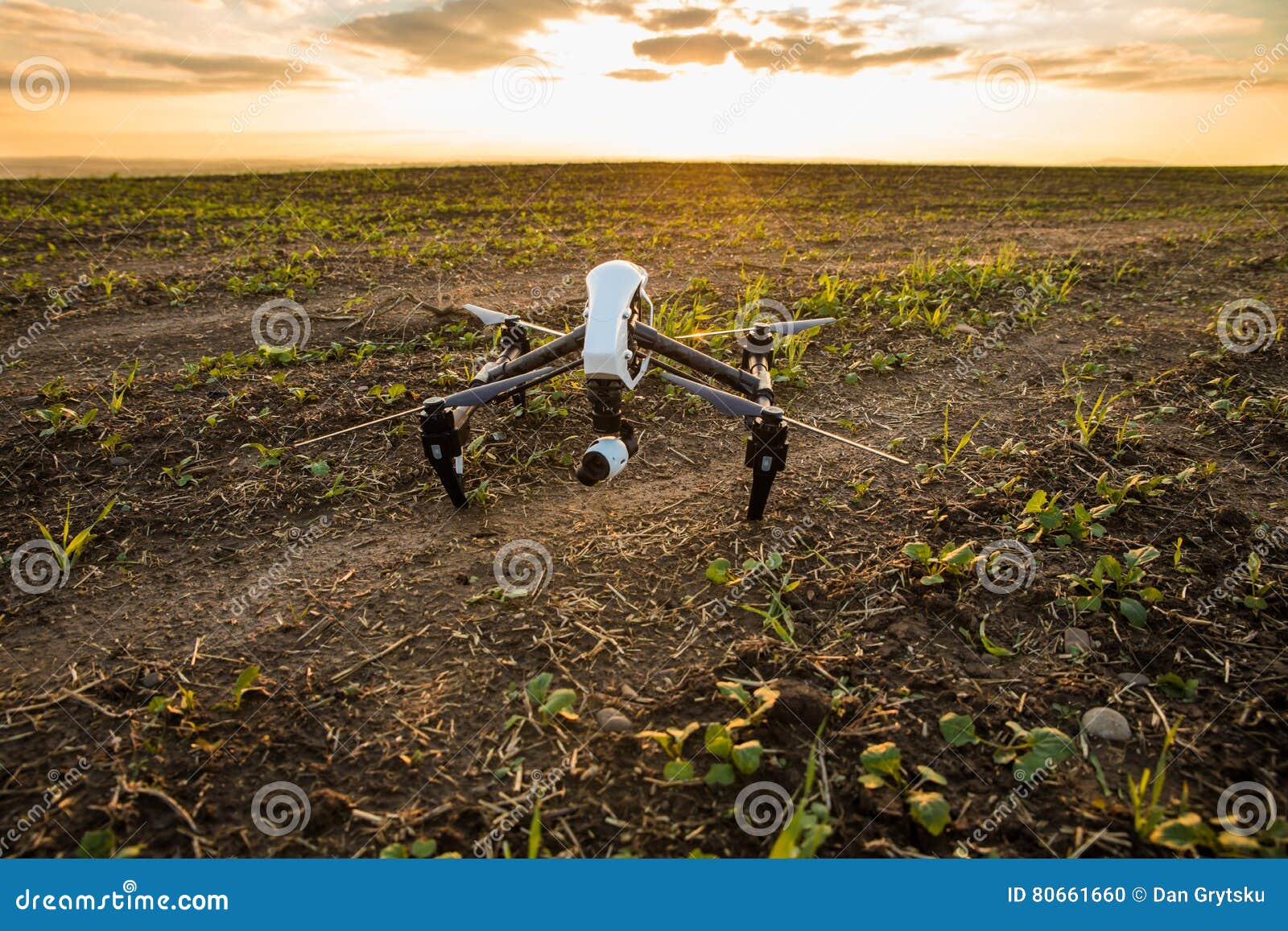 Drone with Digital Camera Flying in Sky Over Field on Sunset Stock ...