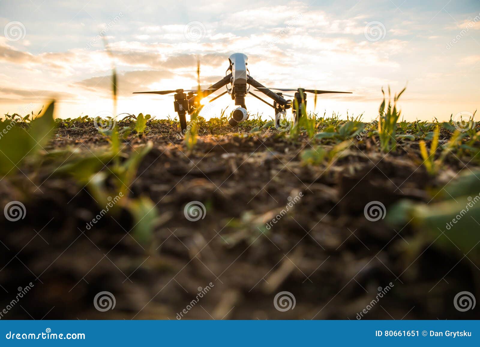 Drone with Digital Camera Flying in Sky Over Field on Sunset Stock ...