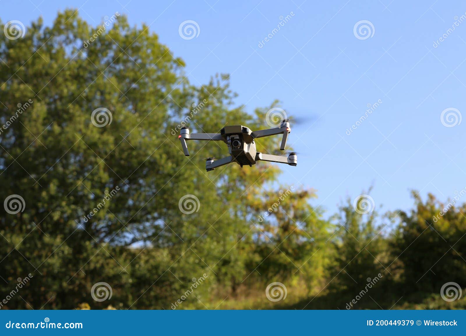Drone Flies Over the Forest Stock Image - Image of drone, technology ...