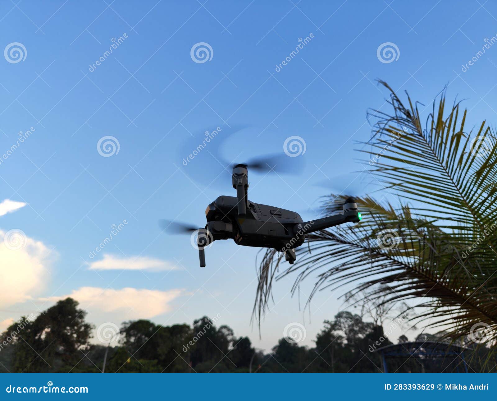 Drone Flying from a Distance Clouds in Background Stock Image - Image ...