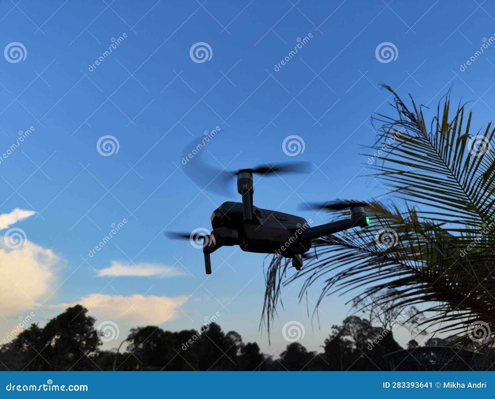 Drone Flying from a Distance Clouds in Background Stock Image - Image ...