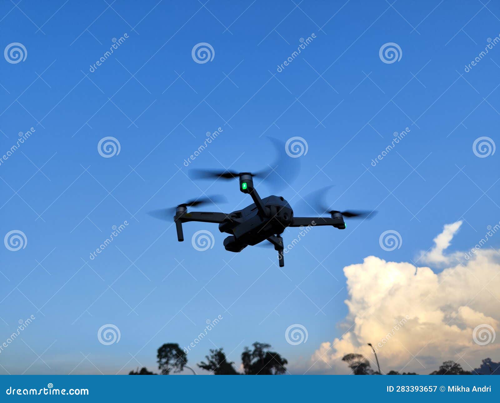 Drone Flying from a Distance Clouds in Background Stock Image - Image ...