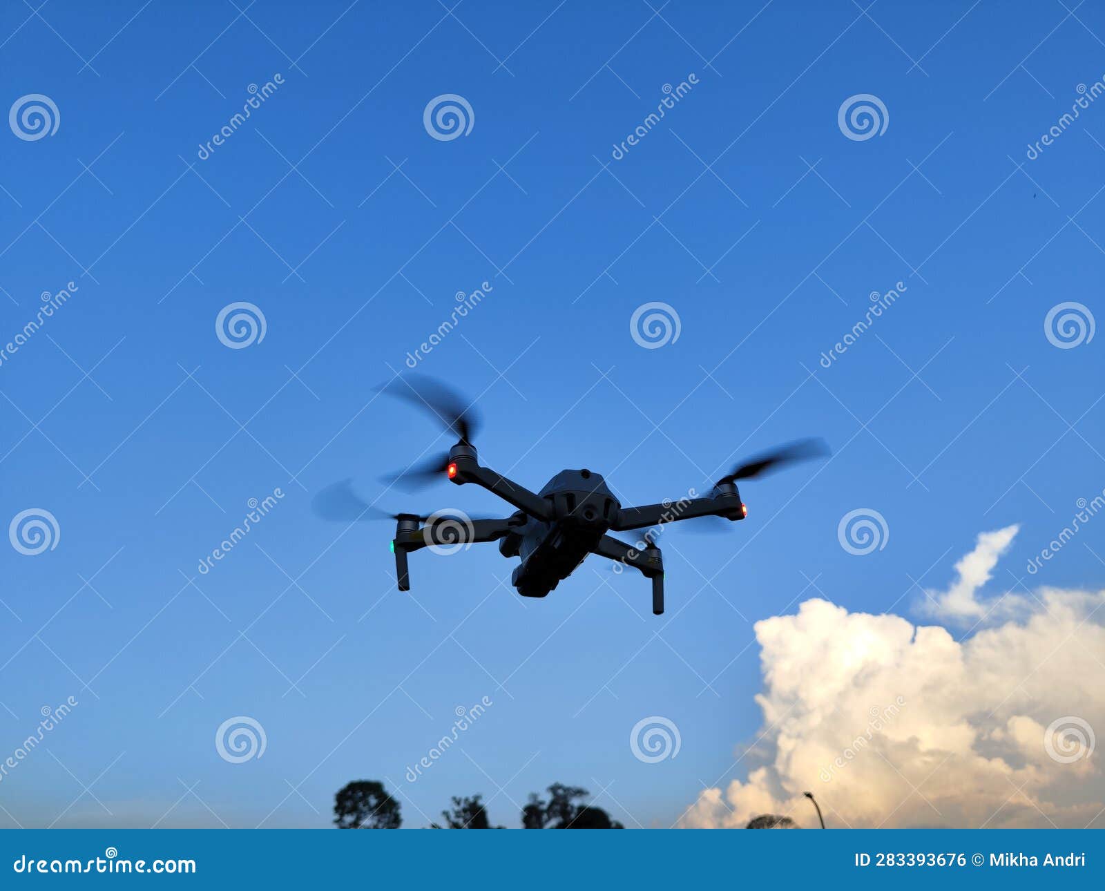 Drone Flying from a Distance Clouds in Background Stock Photo - Image ...
