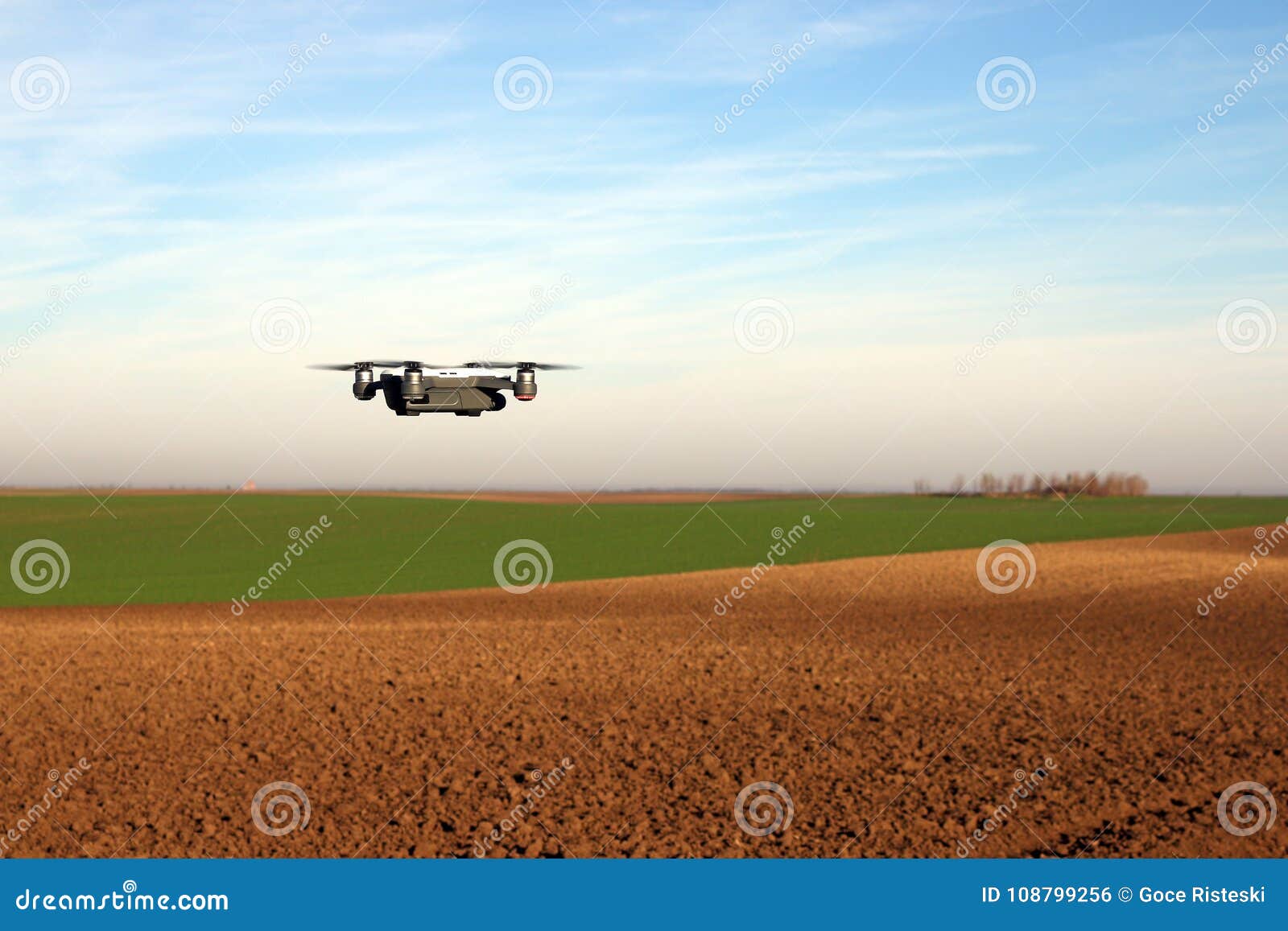 The Drone is Flying Over the Field Stock Photo - Image of flying ...
