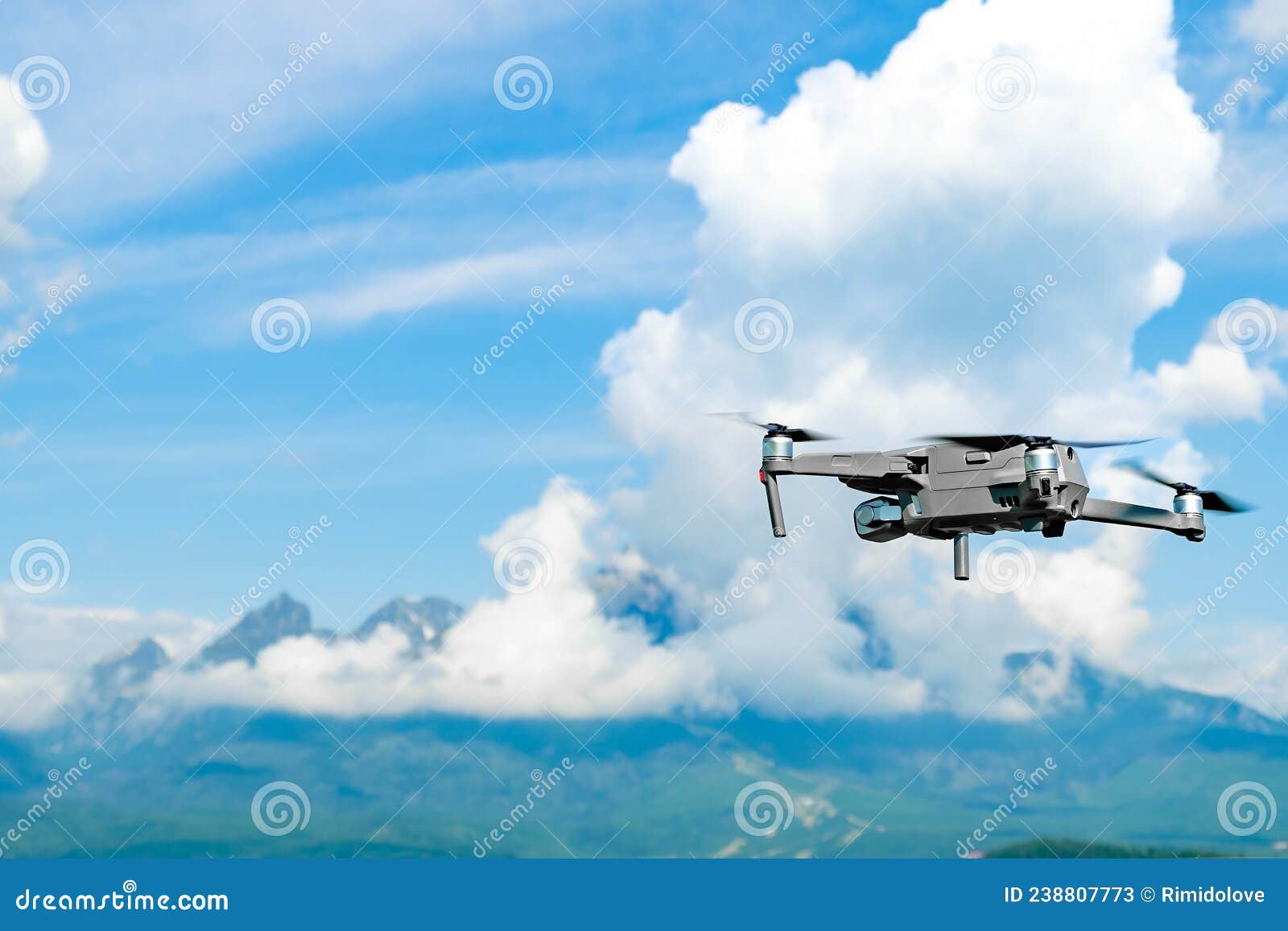 Drone Flying Overhead in a High Cloudy Sky with High Tatra Mountains on ...