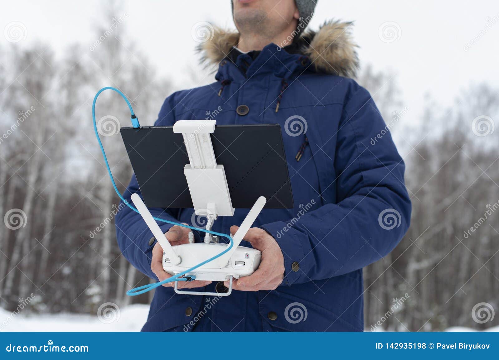 Drone Operator with Remote Control in Winter Landscape Stock Photo ...
