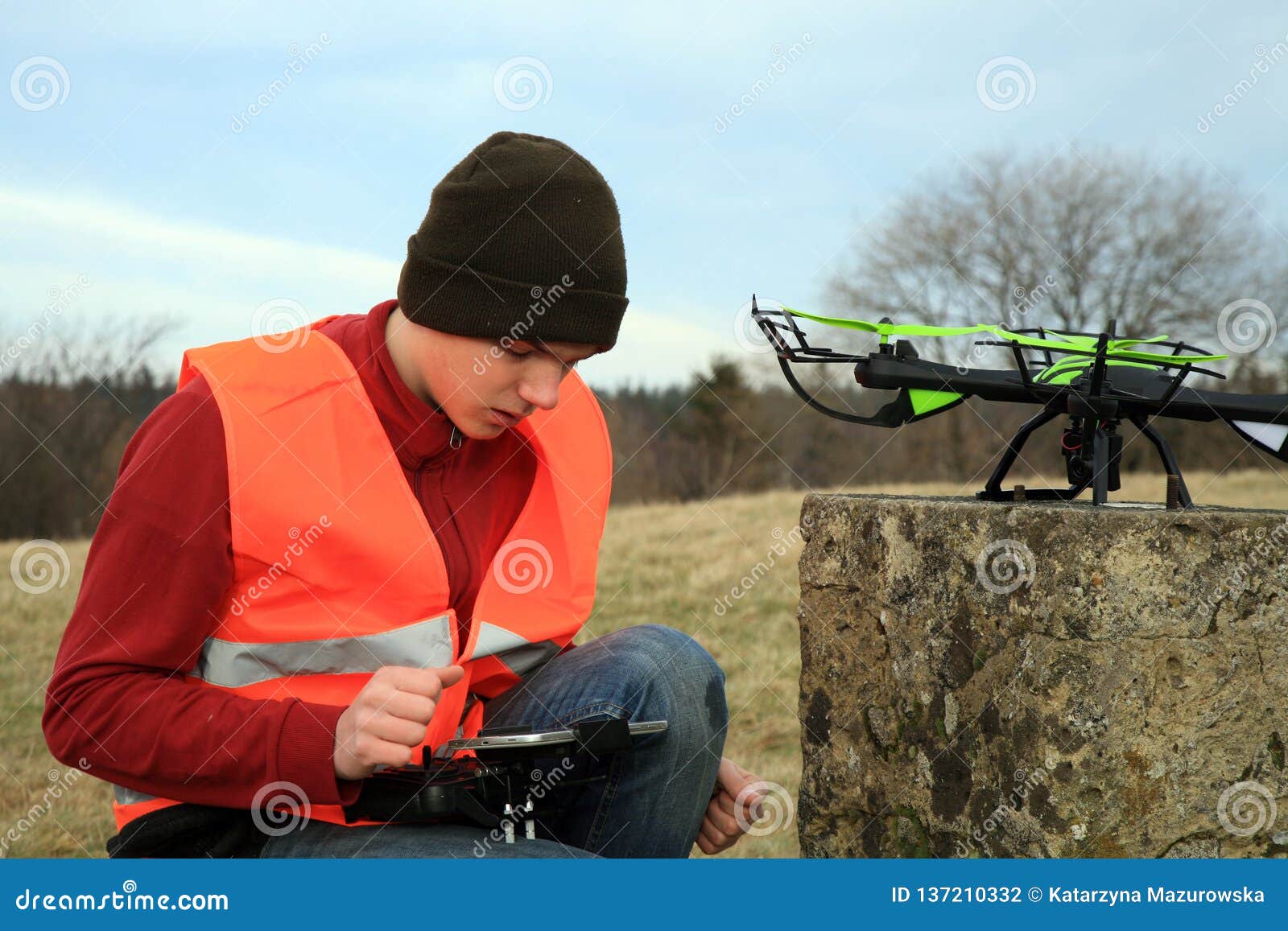 Drone Operator, Top View Of Man Lying In Grass Field And Using Drone ...