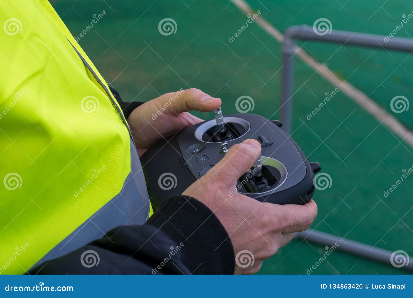 Drone Pilot during an Exercise Wearing a Yellow Jacket. Pilot Pilot ...