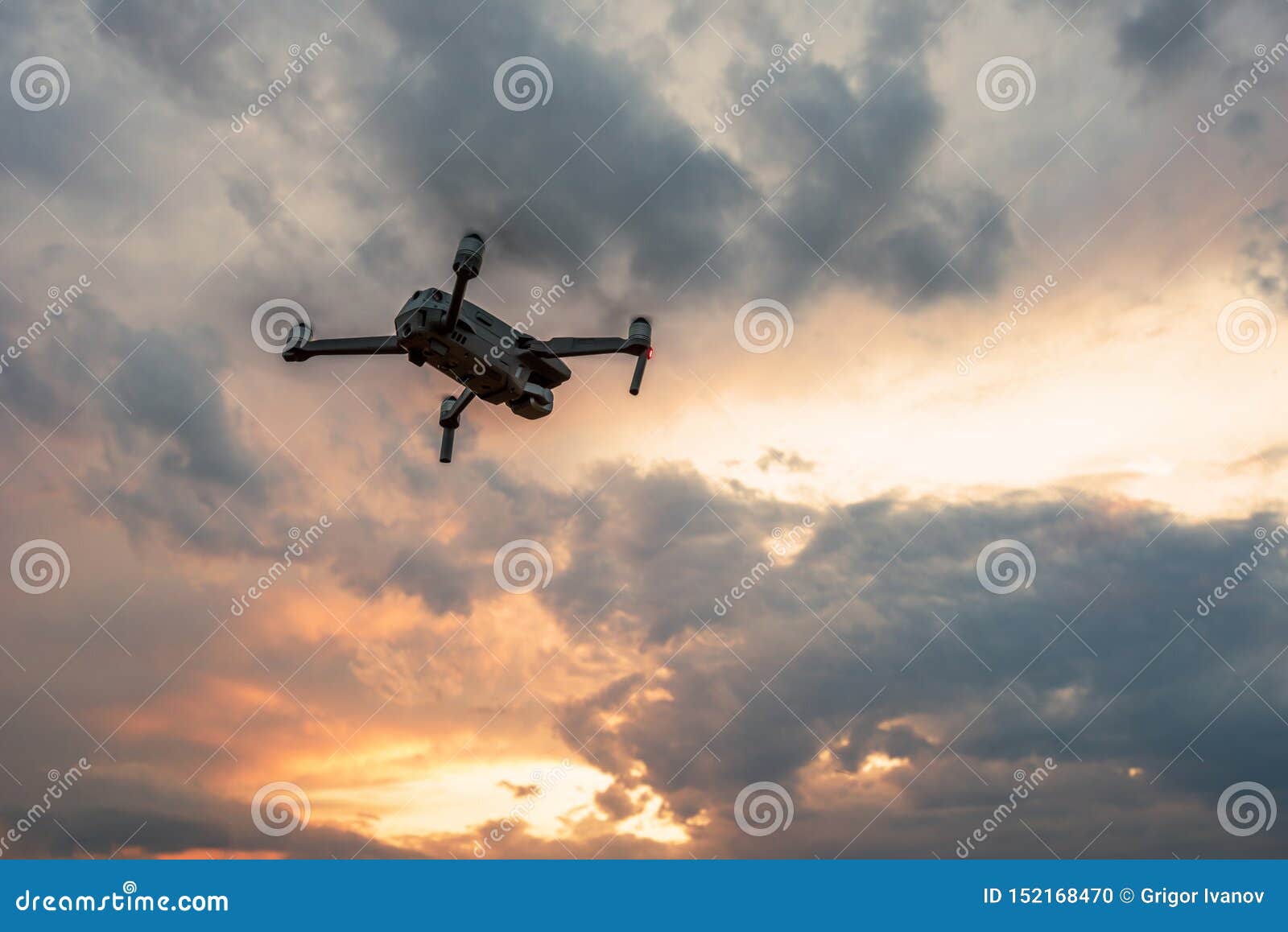 Drone Quadcopter with Digital Camera Flying at Sunset Stock Photo ...