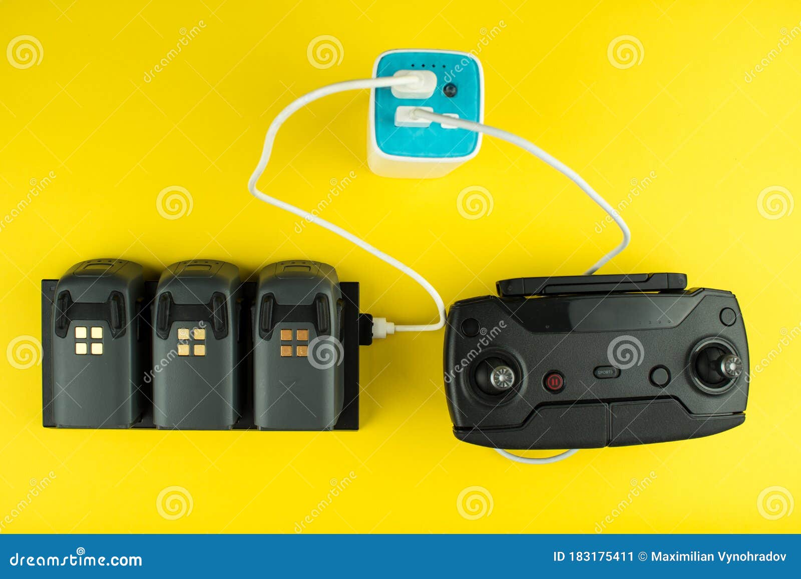 The Drone`s Batteries are Being Charged by the Power Bank. the Remote ...