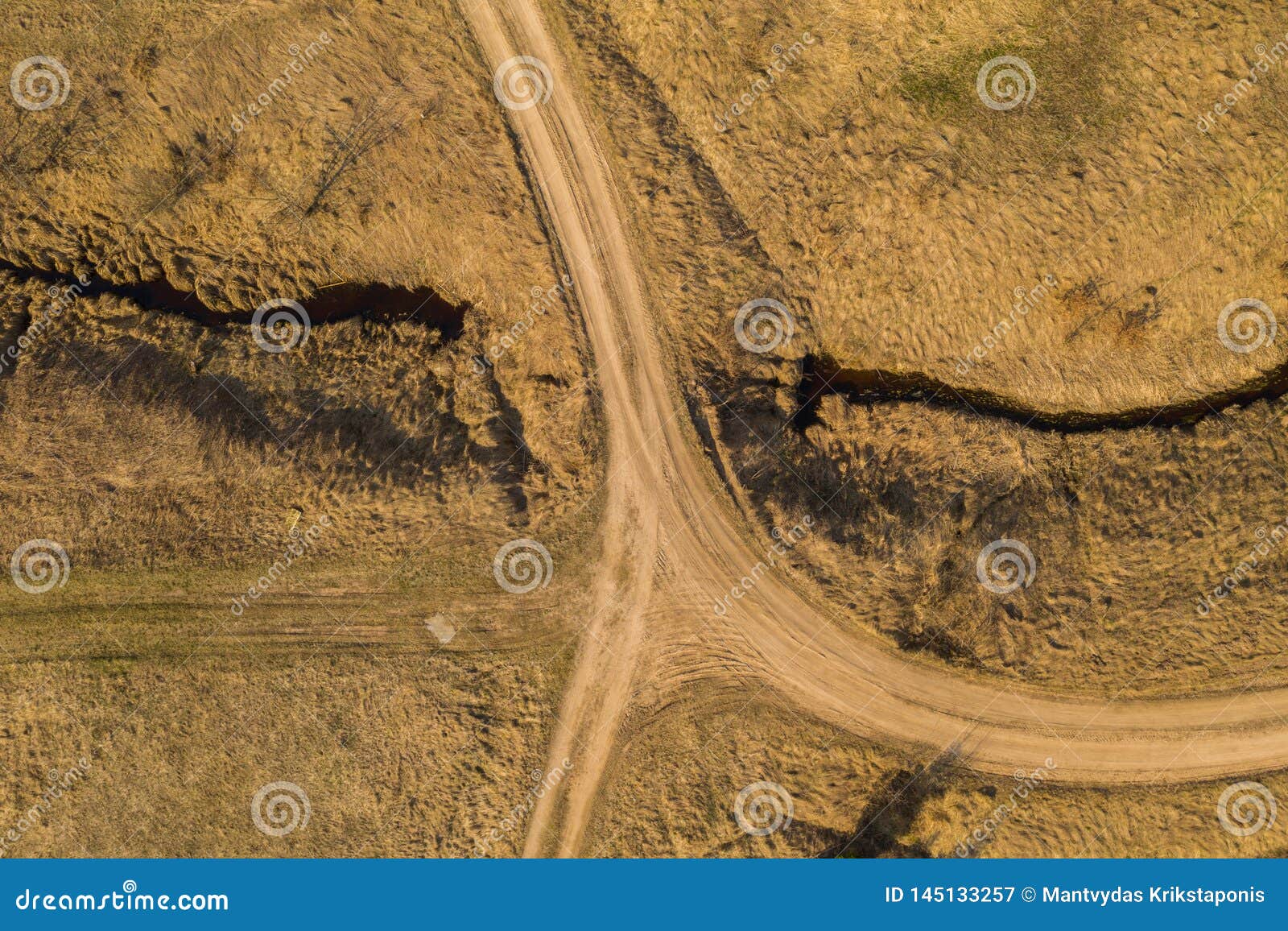 Drone View of Dirt Road Intersection and Small River Next To it Stock ...