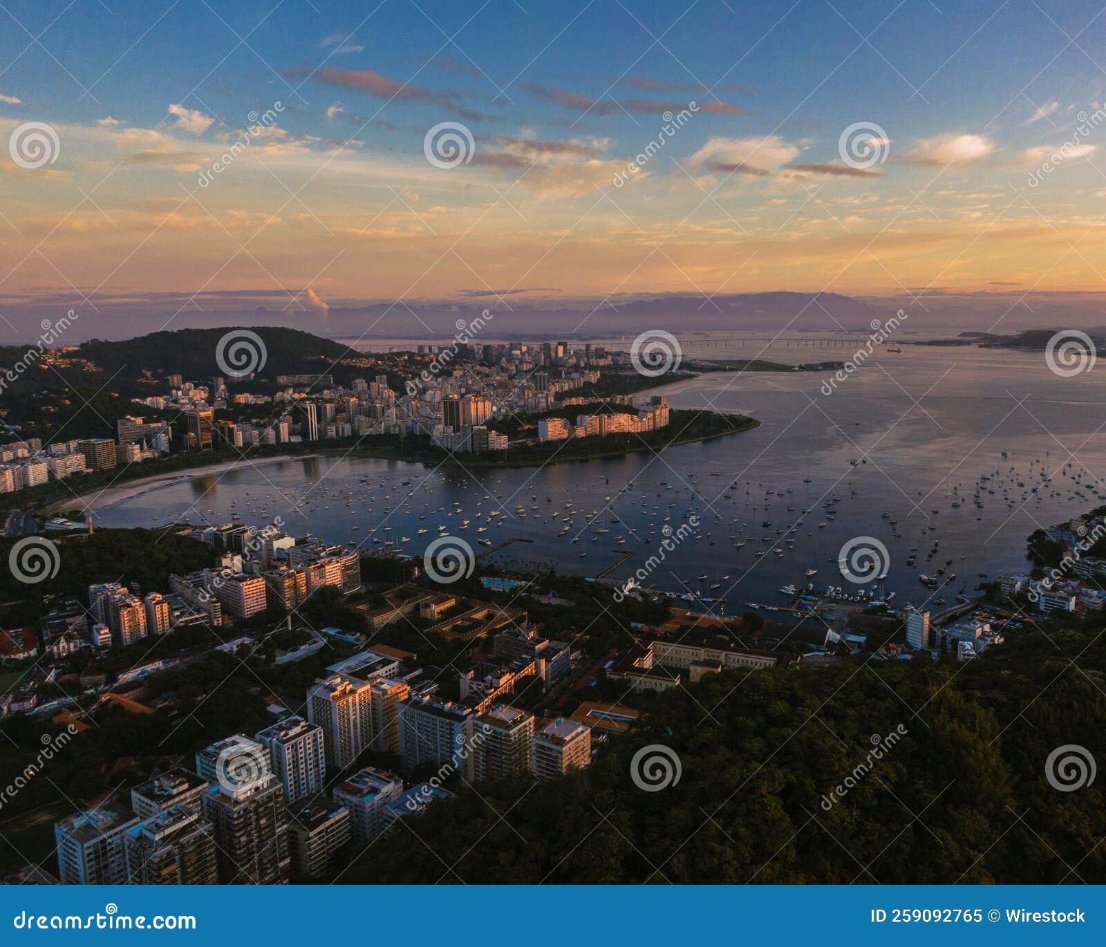 Drone View of Early Sunrise Over a Harbor and a City Stock Image ...