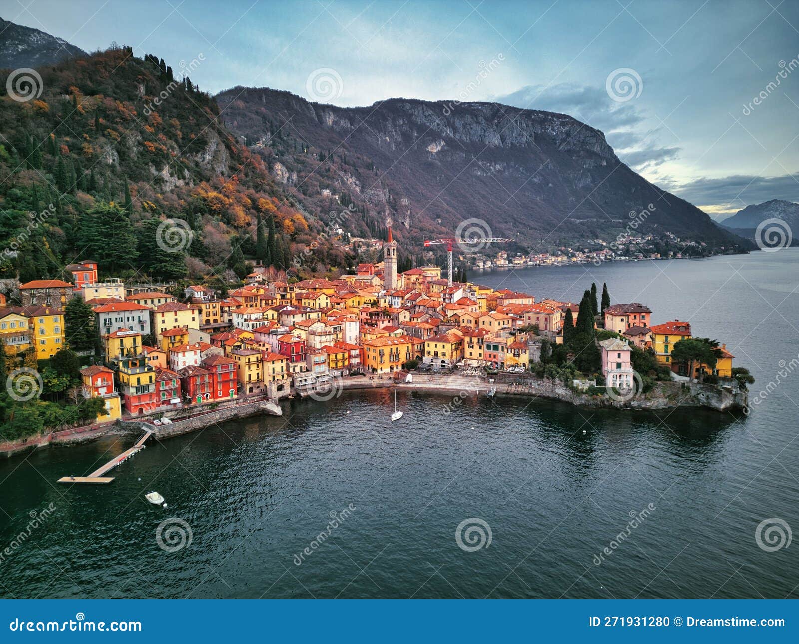 Drone View of Lake Como Surrounded by a Town and Mountains in the ...