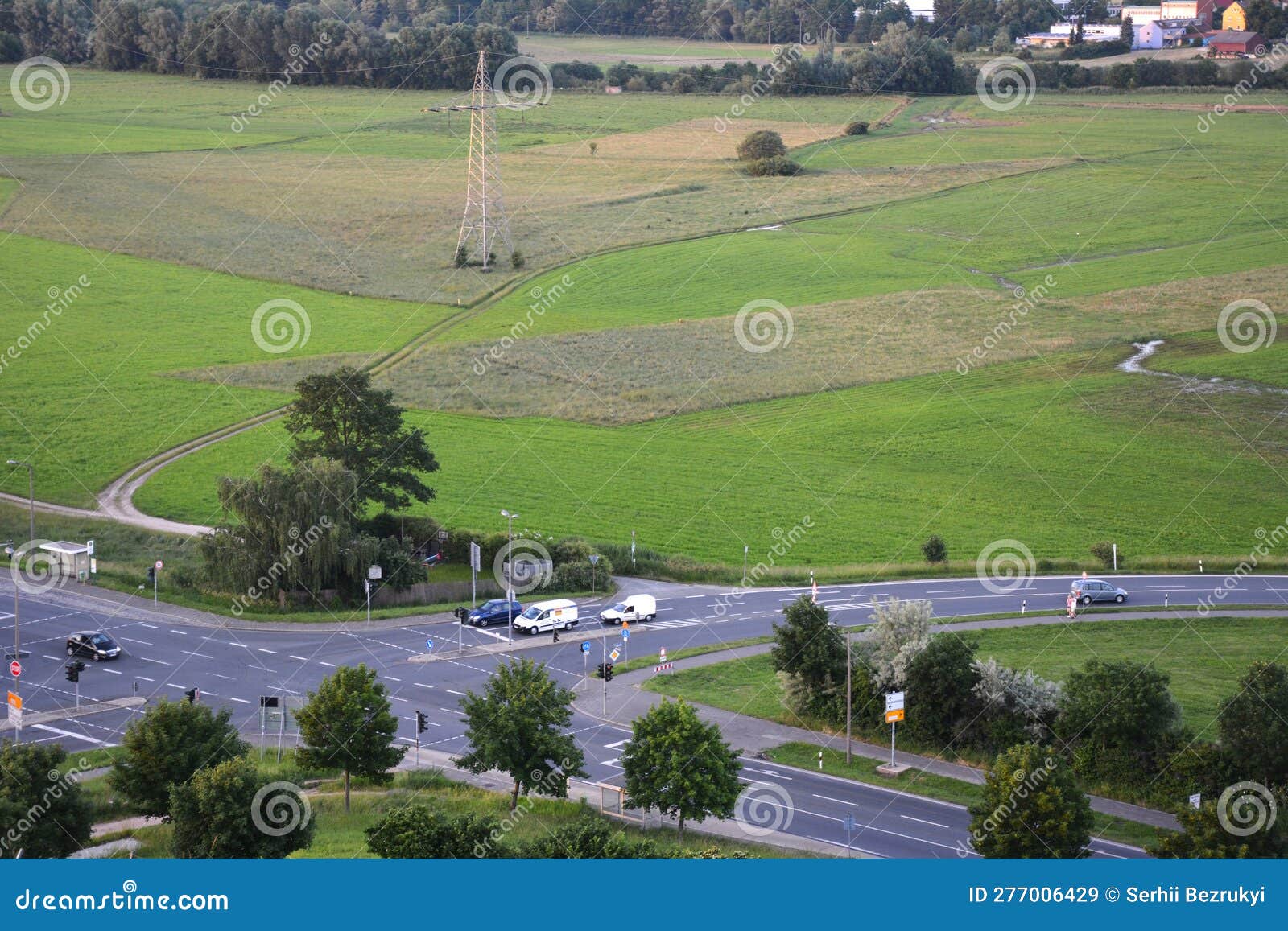 A Drone View of a Road Intersection Near Fields with Greenery Stock ...