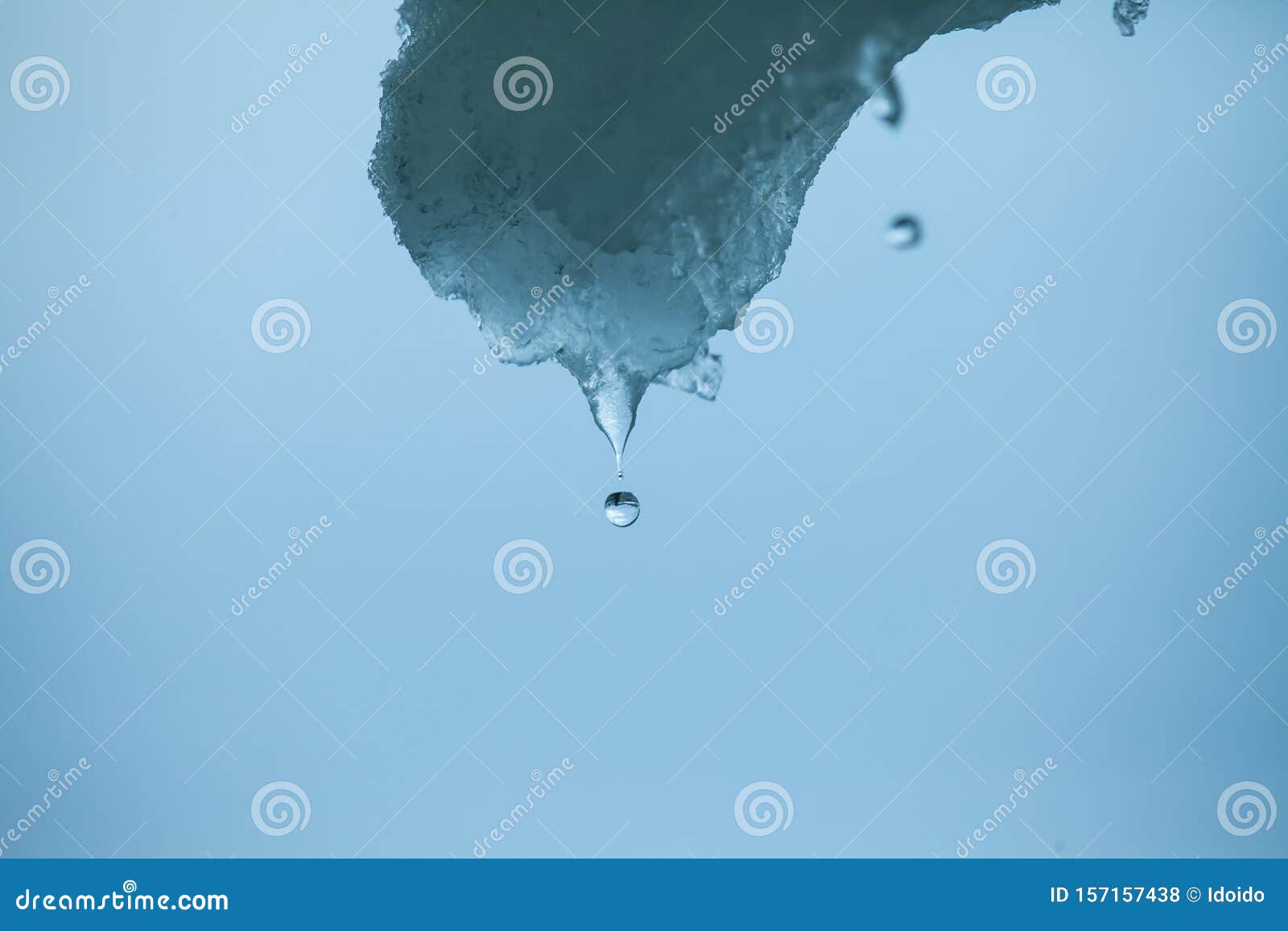 A Drop Dripping during Snow Melt Stock Photo - Image of liquid, color ...