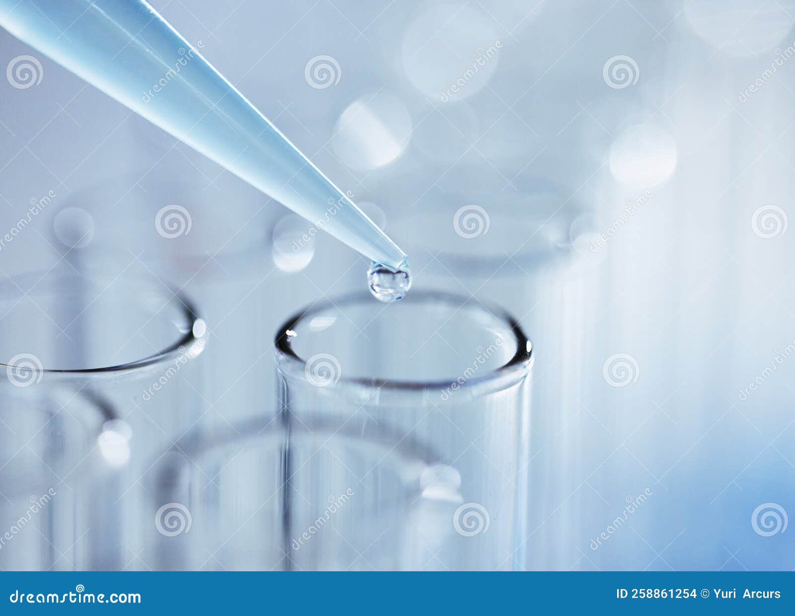 Drop by Drop. an Unknown Person Inserting Sample Fluid into Test Tubes ...