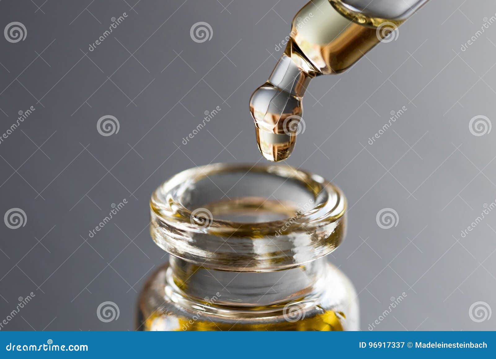 A Drop of Essential Oil is Being Dropped into a Bottle Stock Image ...
