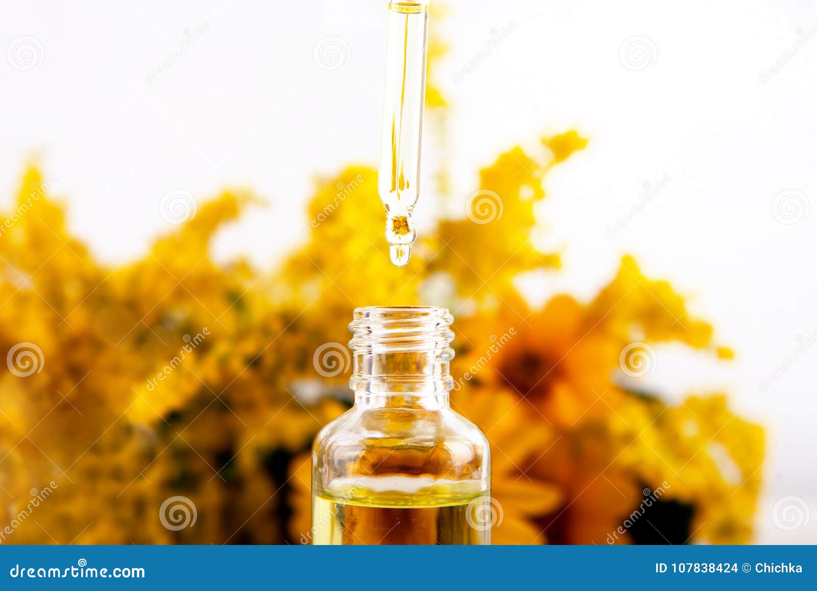 Drop Falling from Dropper of Essential Oil, Aromatherapy Essence, or ...