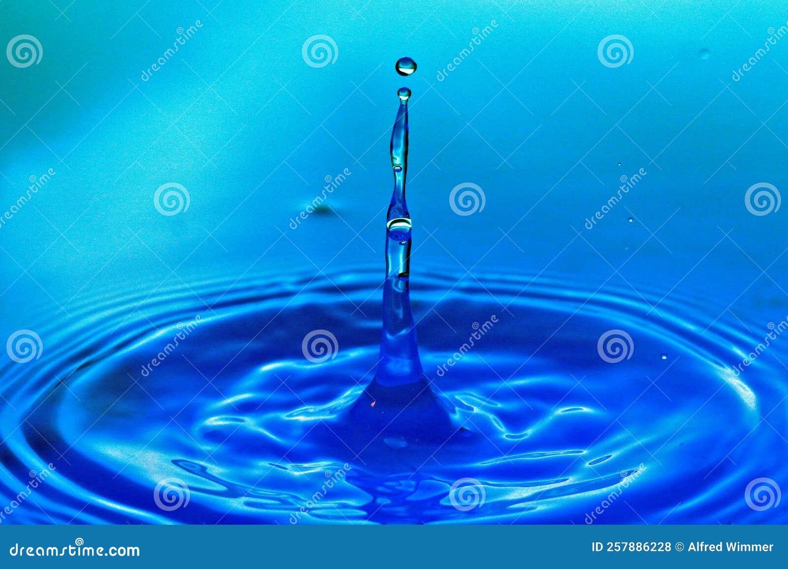 A Drop Falls into the Water, Forming a Column with a Figure Stock Photo ...