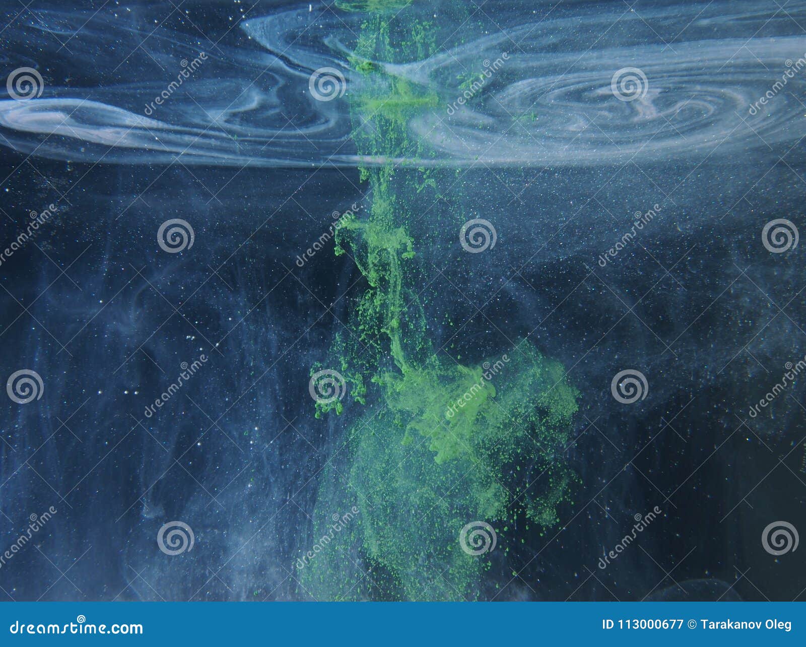 A Drop of Green Paint Dissolves in Water. an Abstract Photo Stock Image ... A Drop of Green Paint Dissolves in Water. an Abstract Photo Stock Image ...