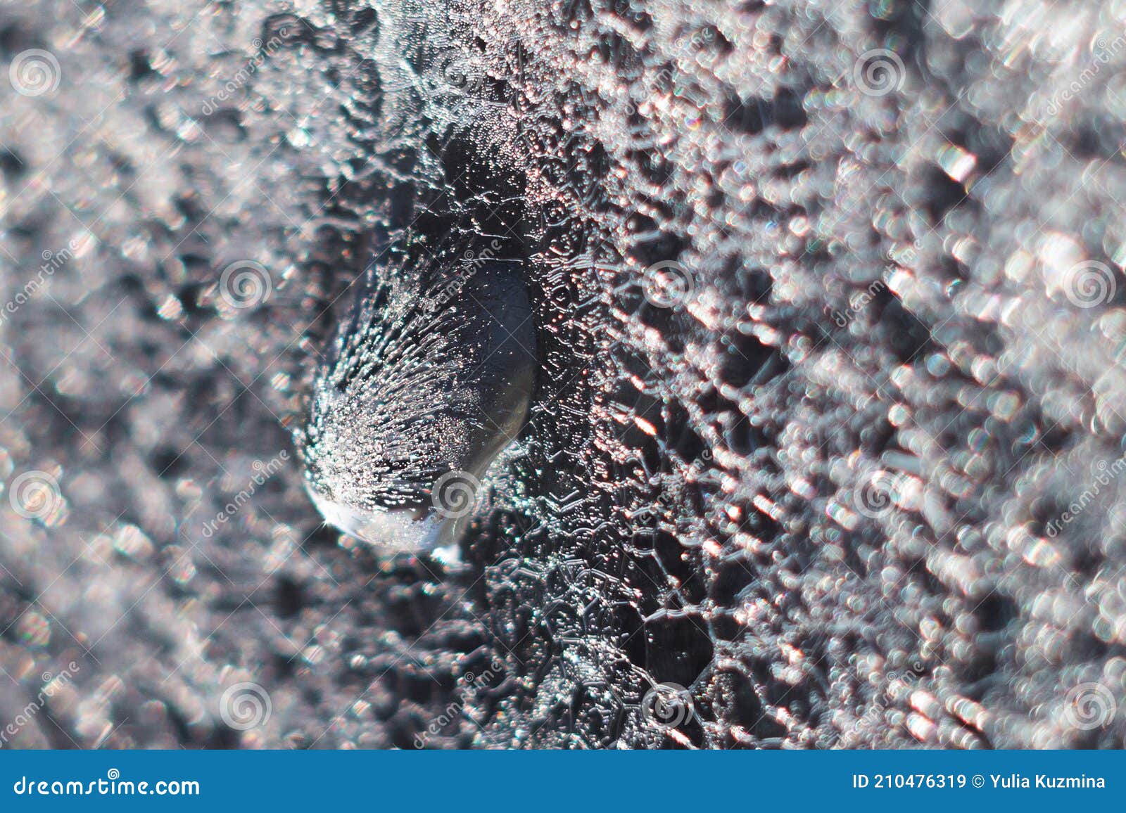 A Drop on Ice in a Shallow Depth of Field. Melting Ice Spring. Drops ...