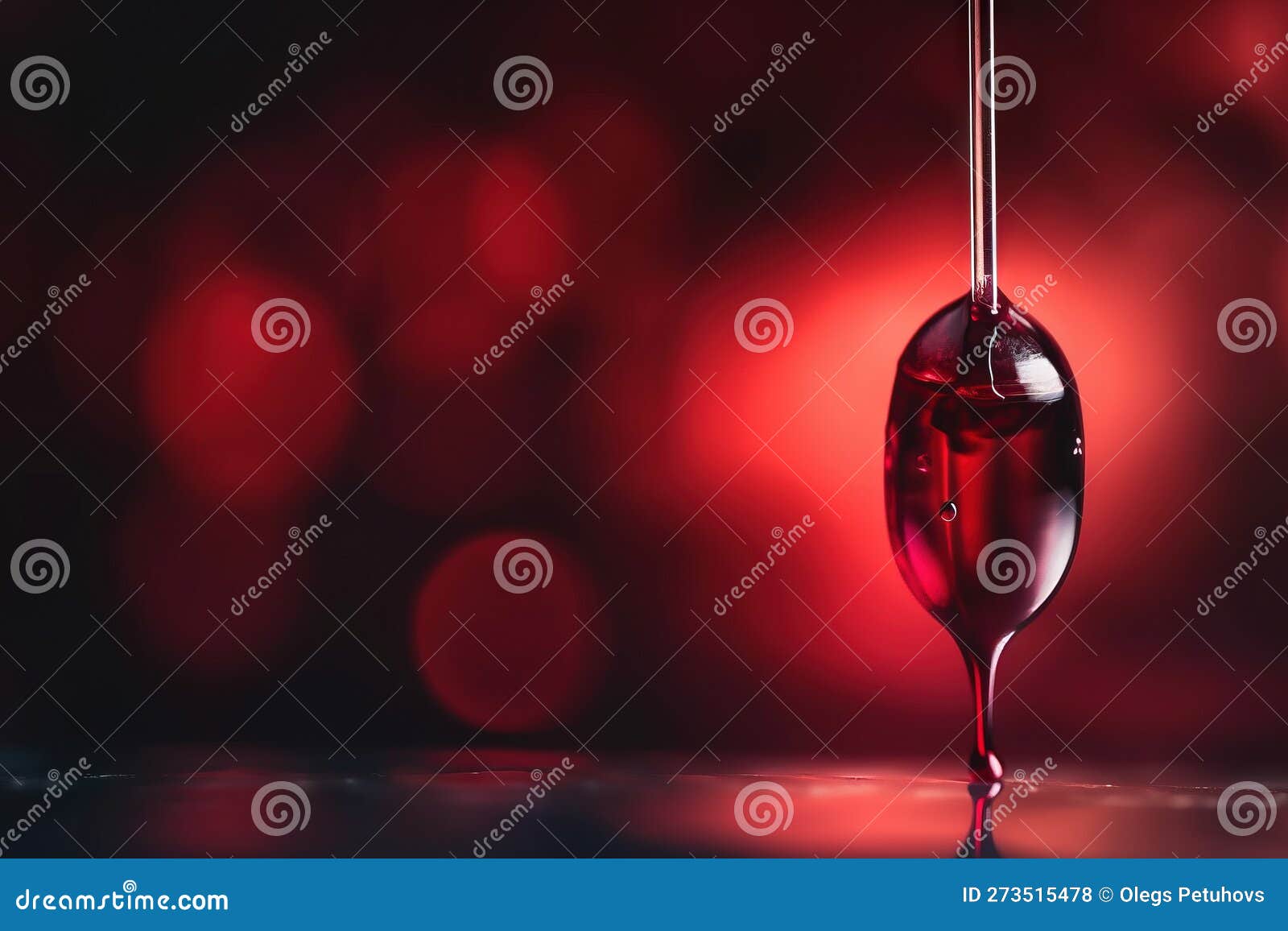 A Drop of Liquid is Being Dropped into a Glass of Water Stock Photo ...