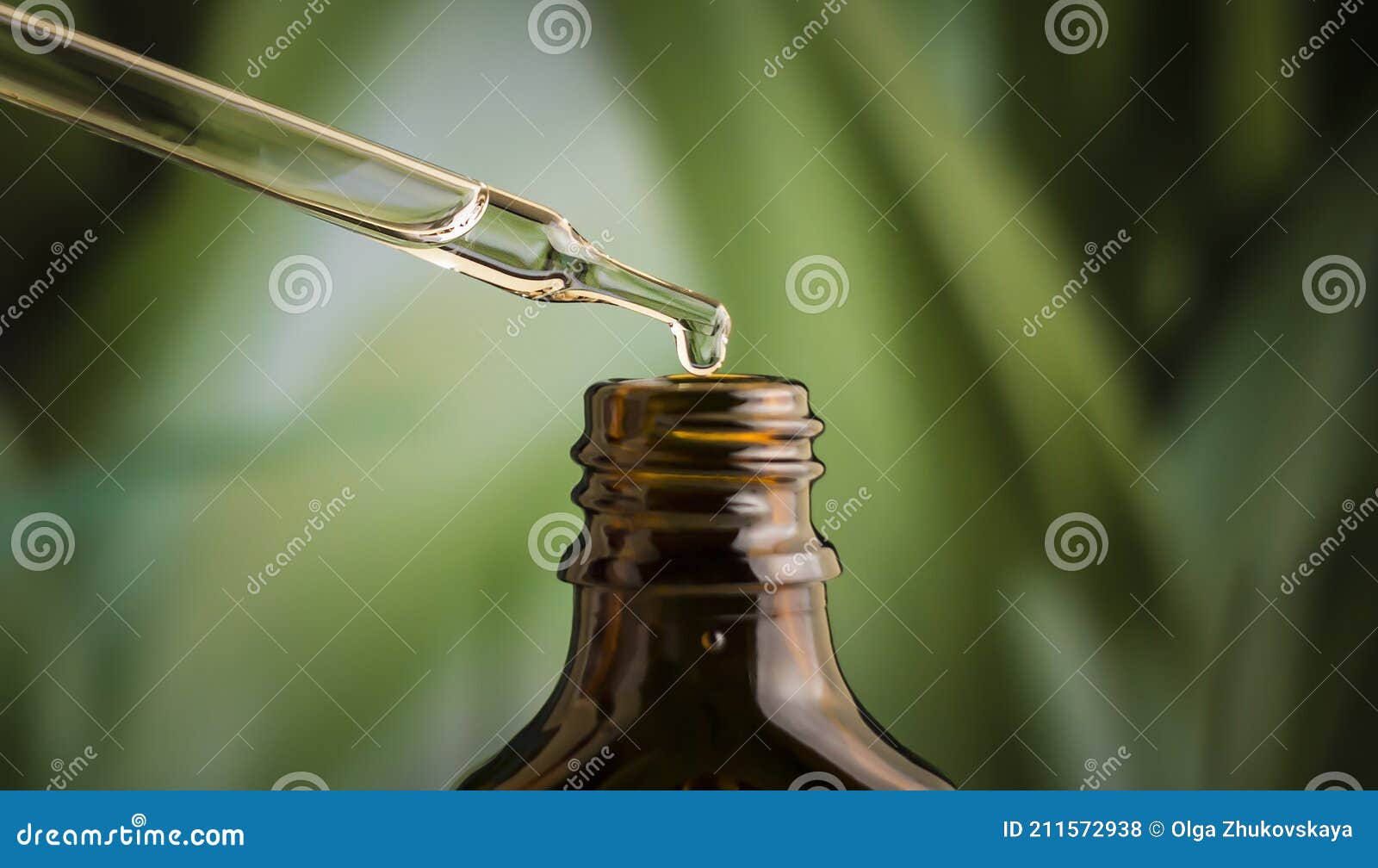 A Drop of Liquid from a Pipette on a Green Background Stock Photo ...